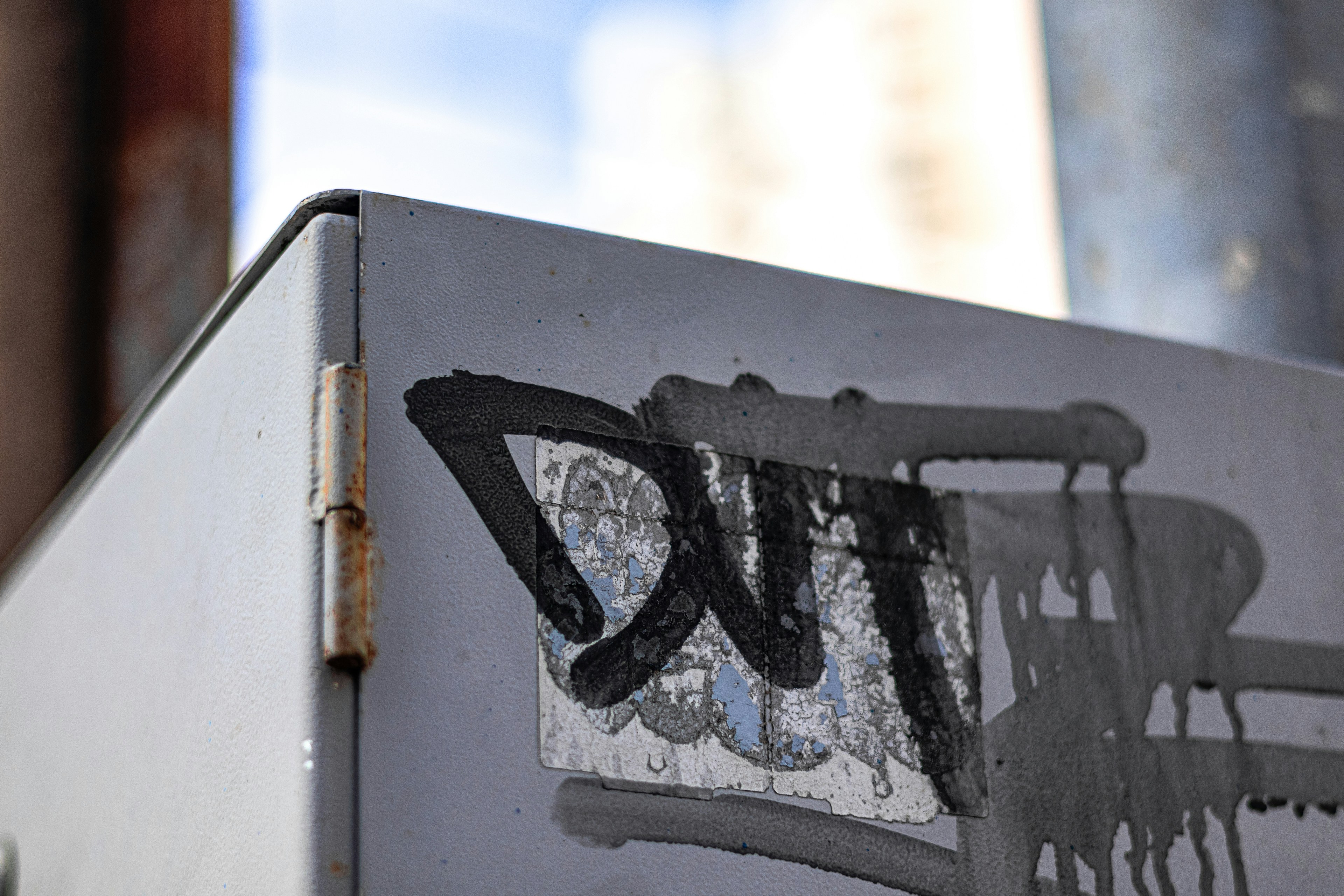 Graffiti Portrait on a Weathered Metal Panel