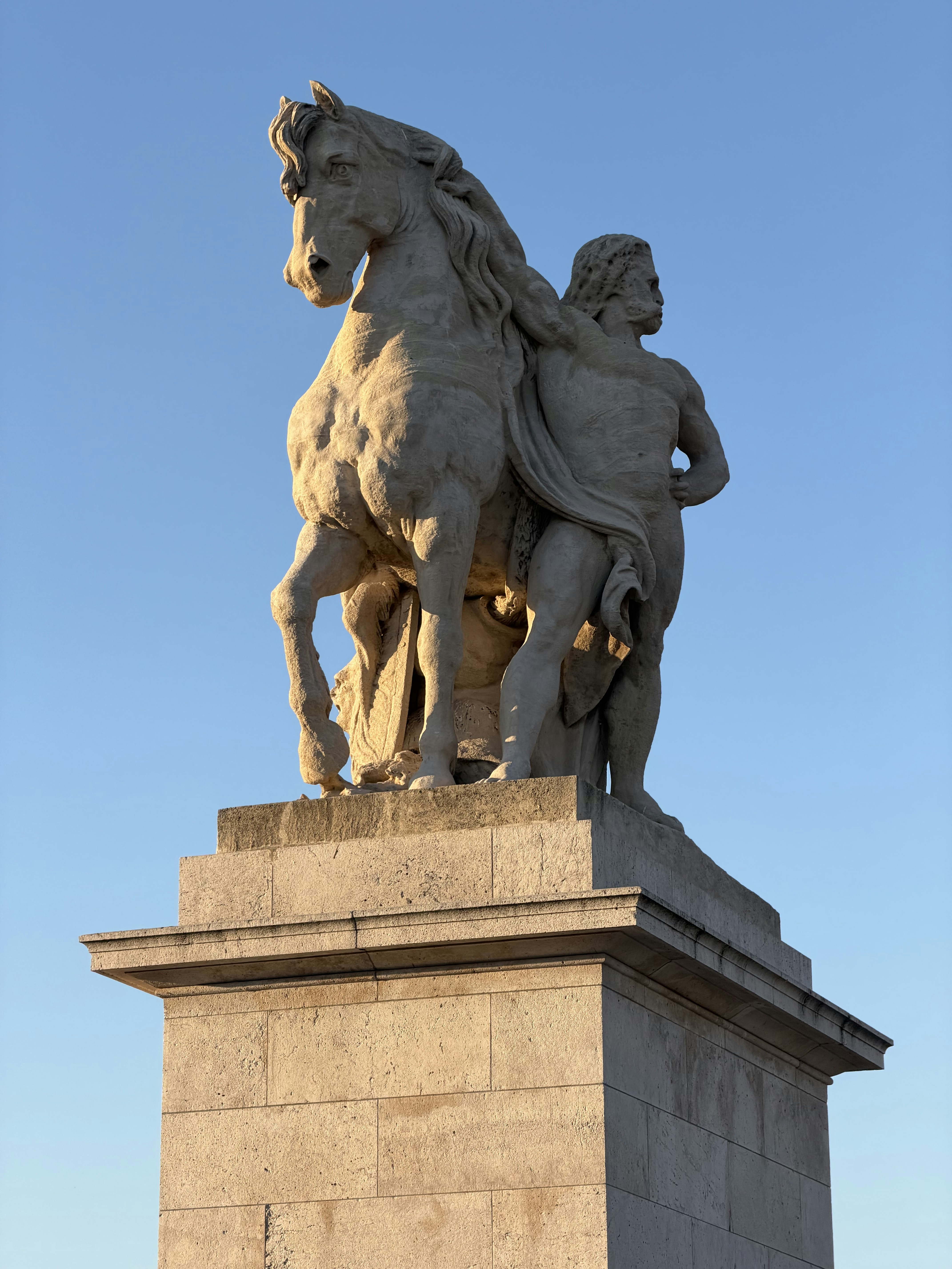 Equestrian Guardian: A Monumental Moment Under a Clear Blue Sky