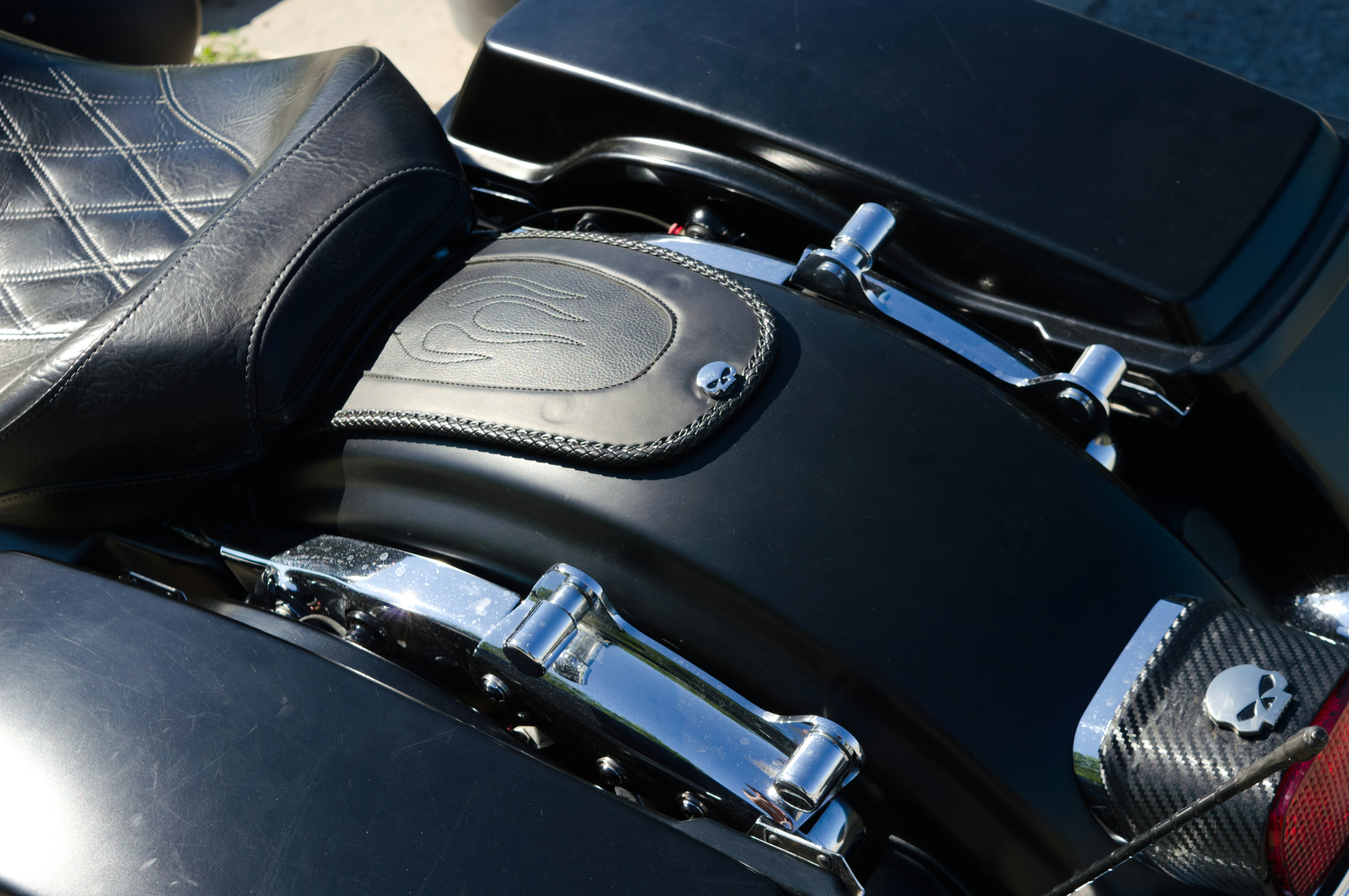 Rugged Comfort: Motorcycle Seat and Tank Details Under Streetlight