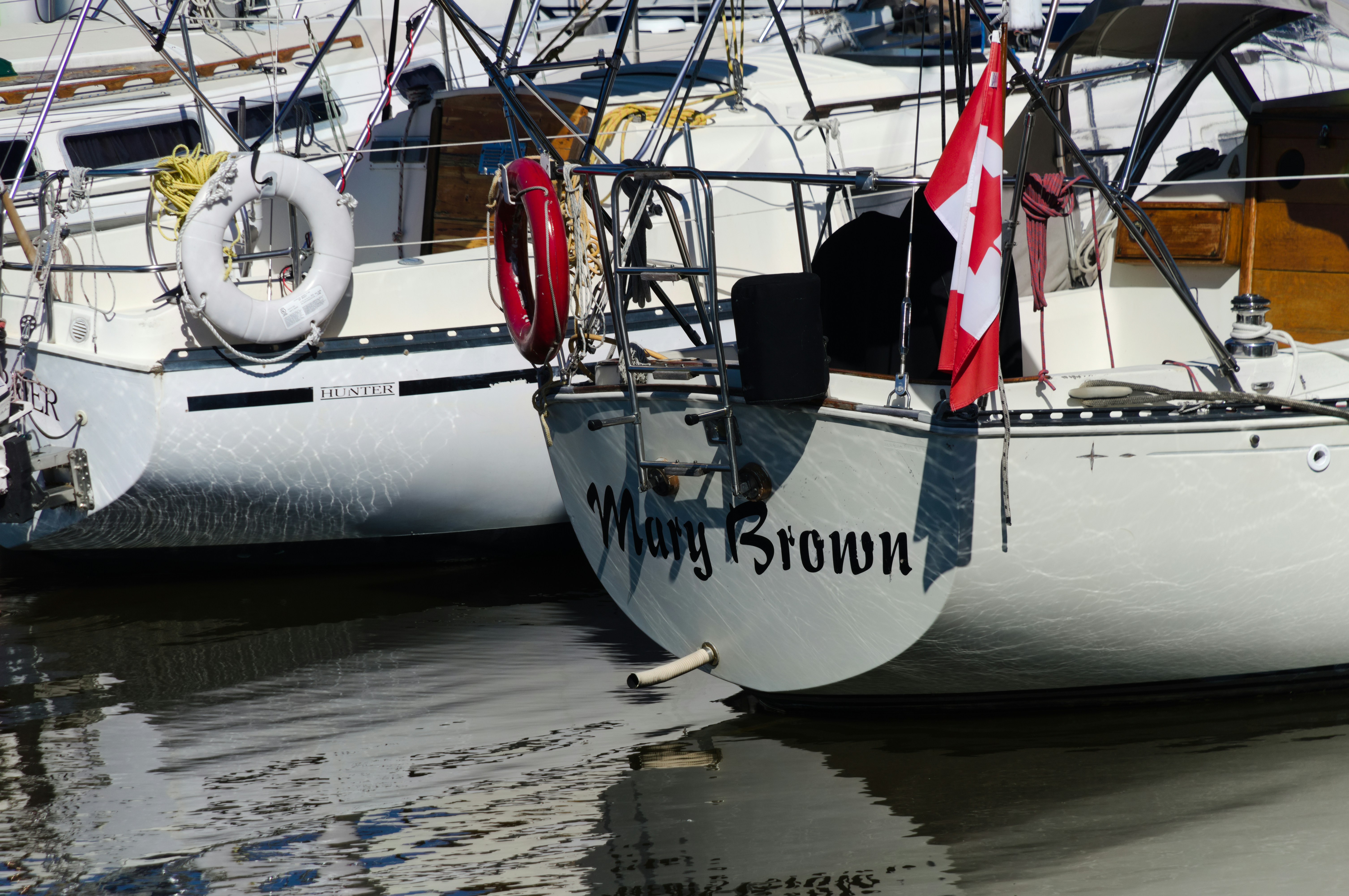 Hinged on the Stern: Two yachts Named Mary Brown Resting at Docks