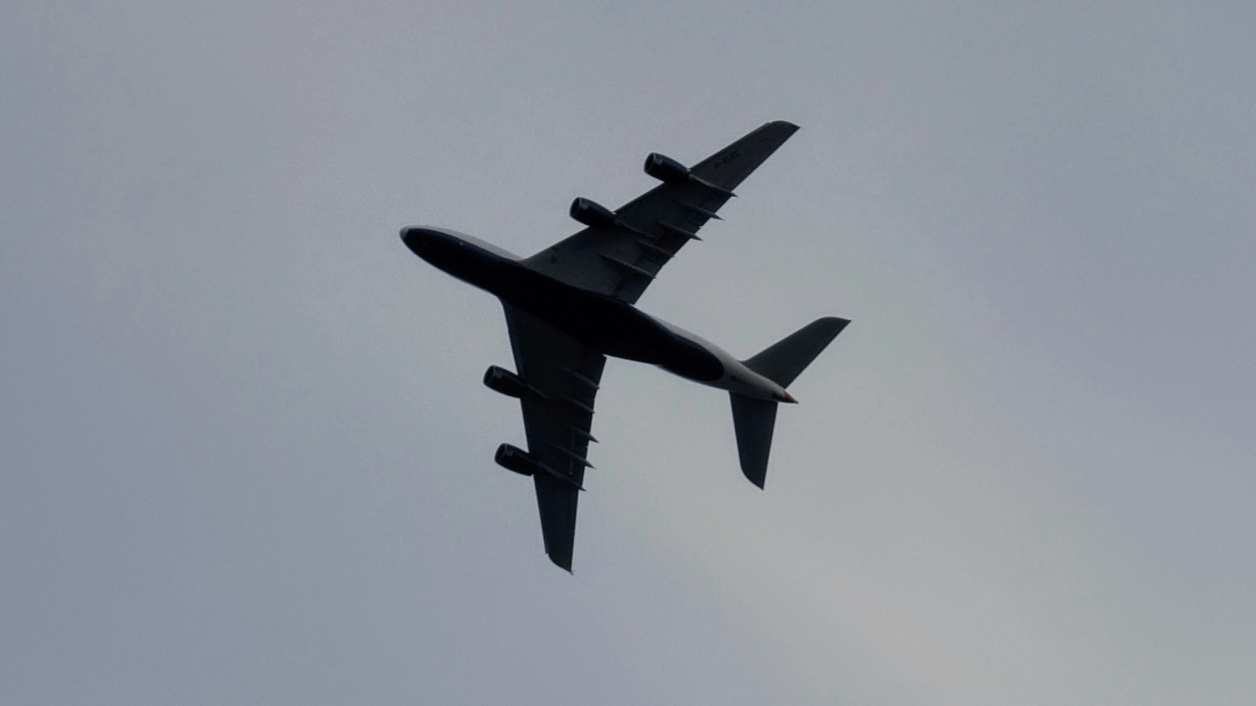 Silhouette of a Quadjet in a Soft Sky