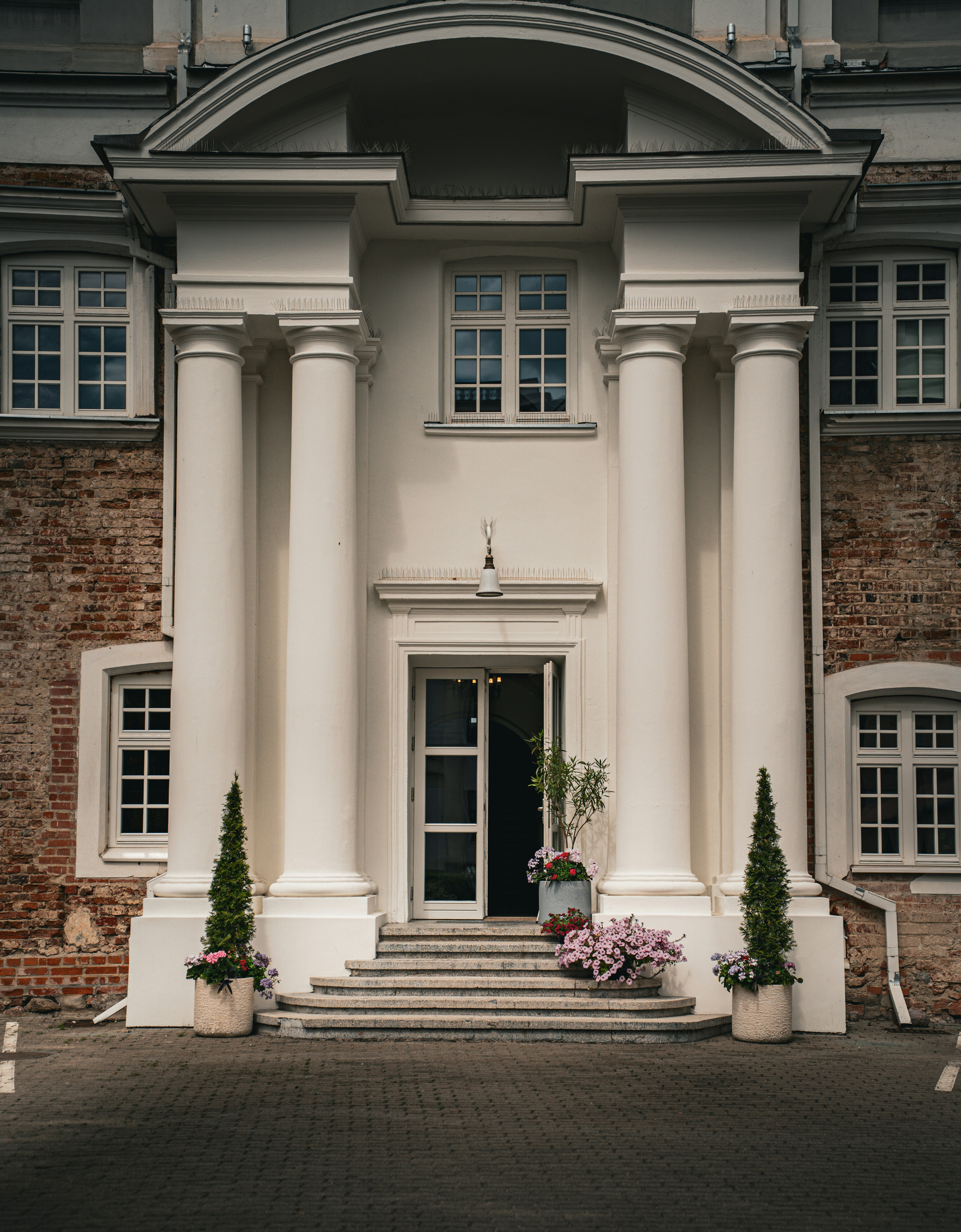 Grand Entrance with Classical Columns and Spring Arrangements