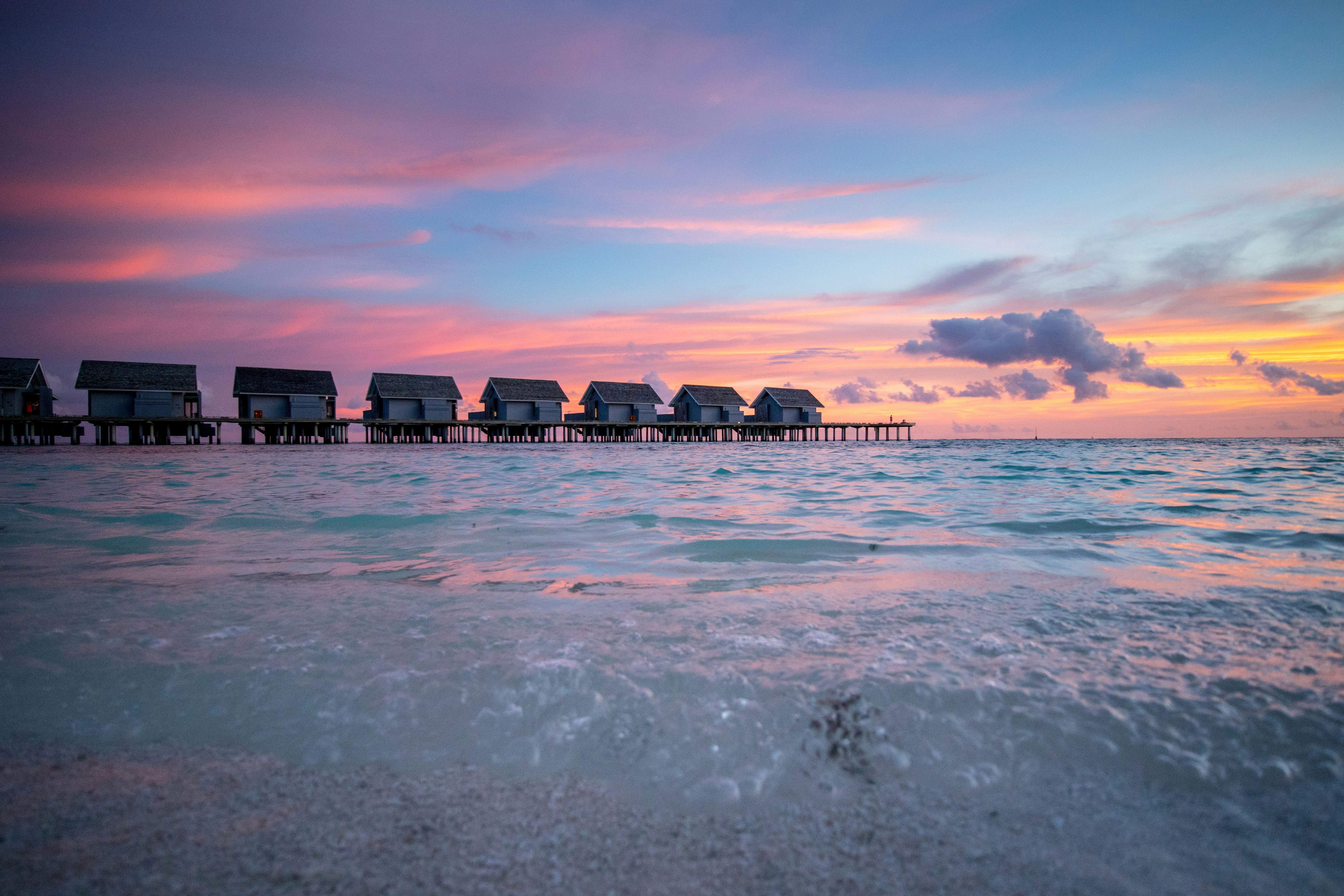 Sunset Overwater Bungalows: Tranquil Dusk on Stilts