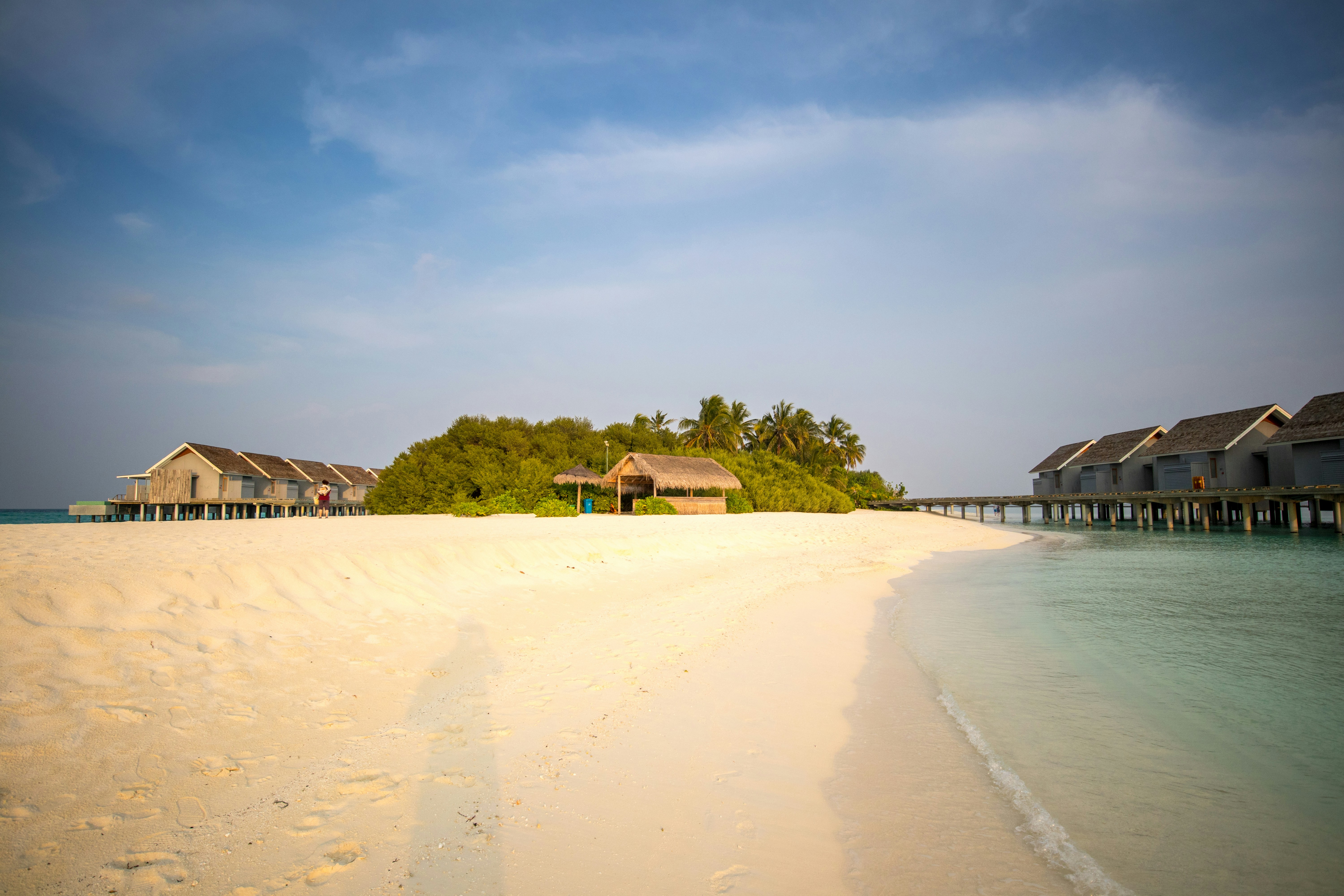 Sunlit Boulevard: A Quiet Beach with Overwater Bungalows