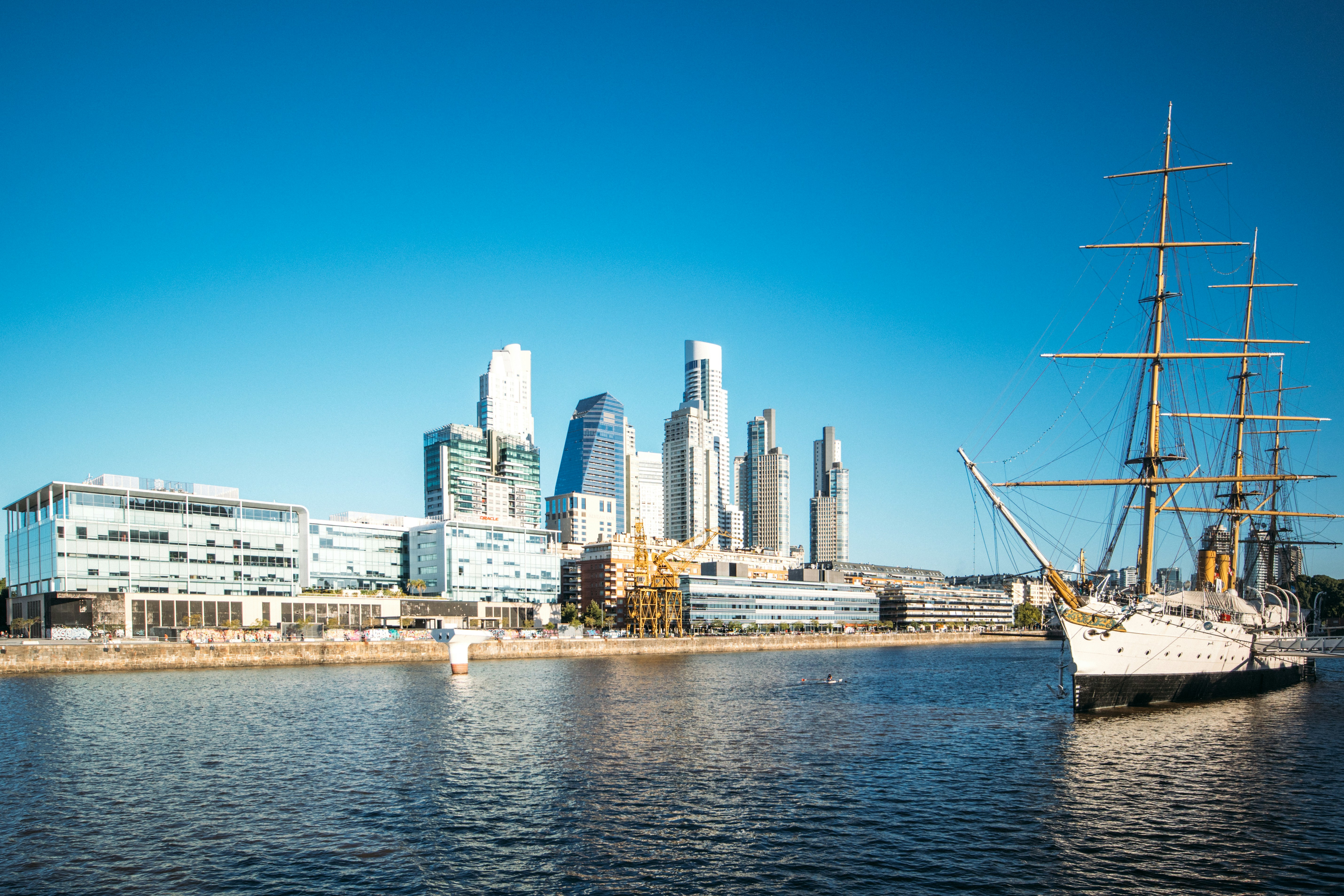 Harbor Wings: A City Skyline Near the Tall Ship