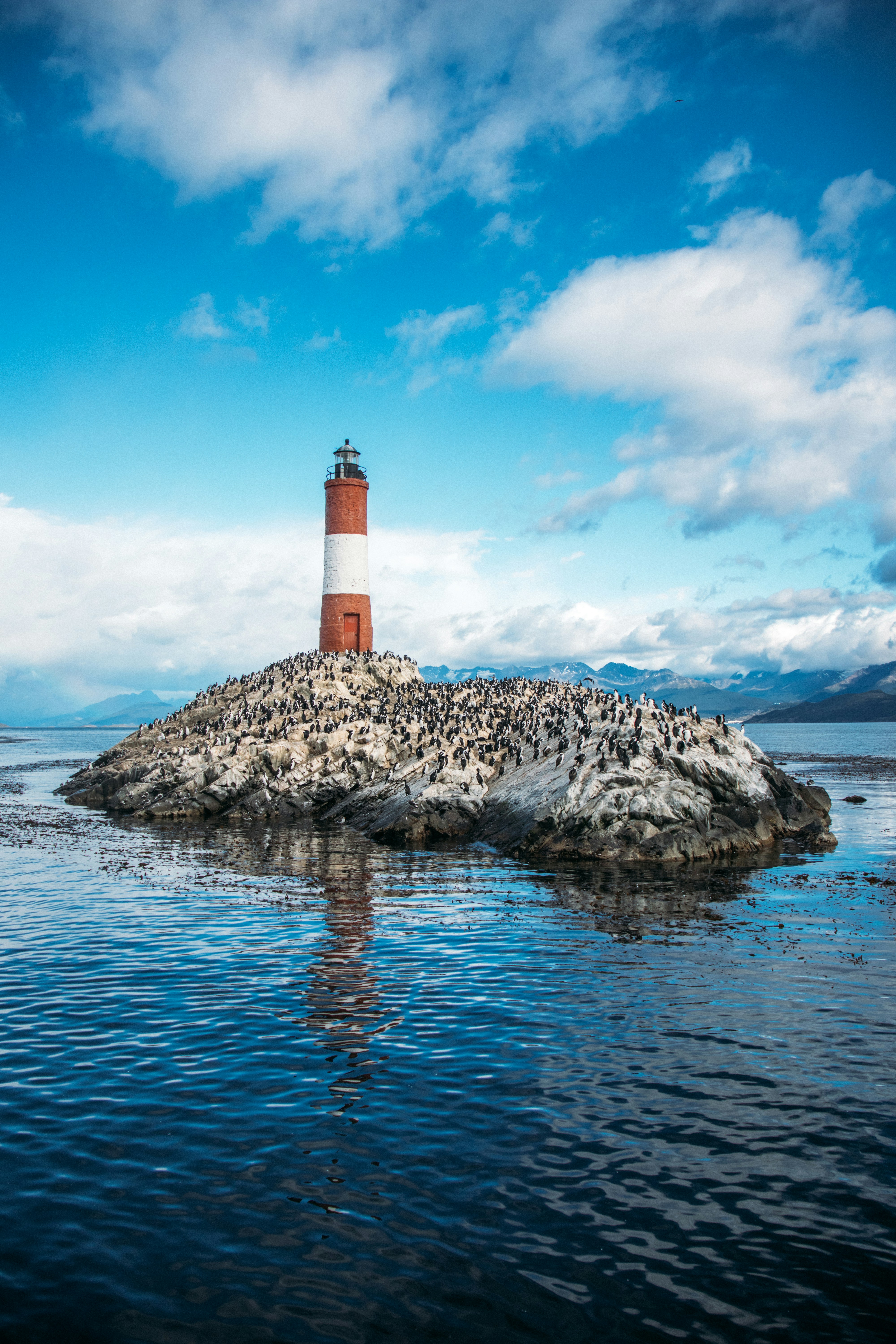 Lighthouse on a Granite Islet Amid Calm Atlantic Waters