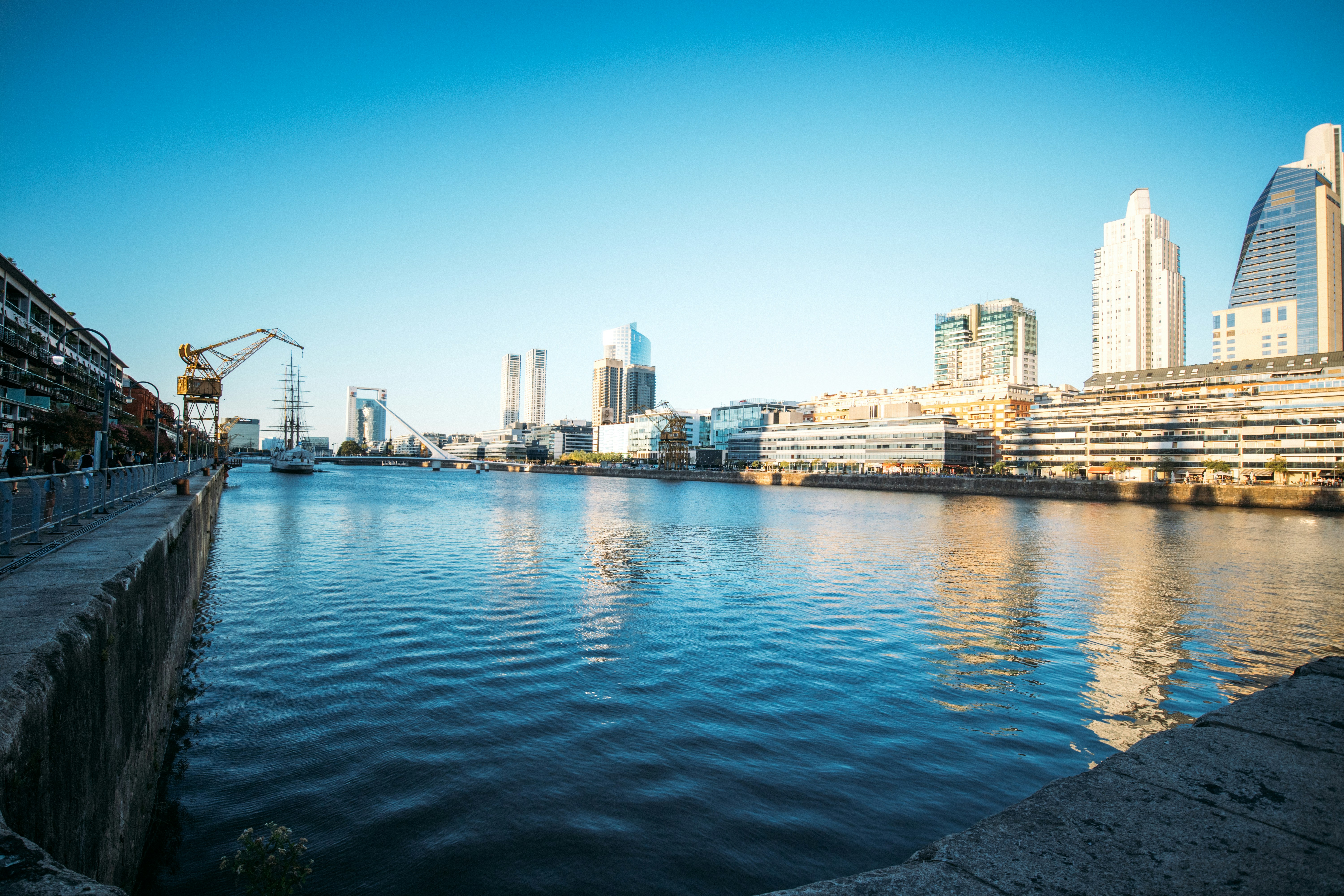 Urban Riverfront Symphony under a Clear Skyline