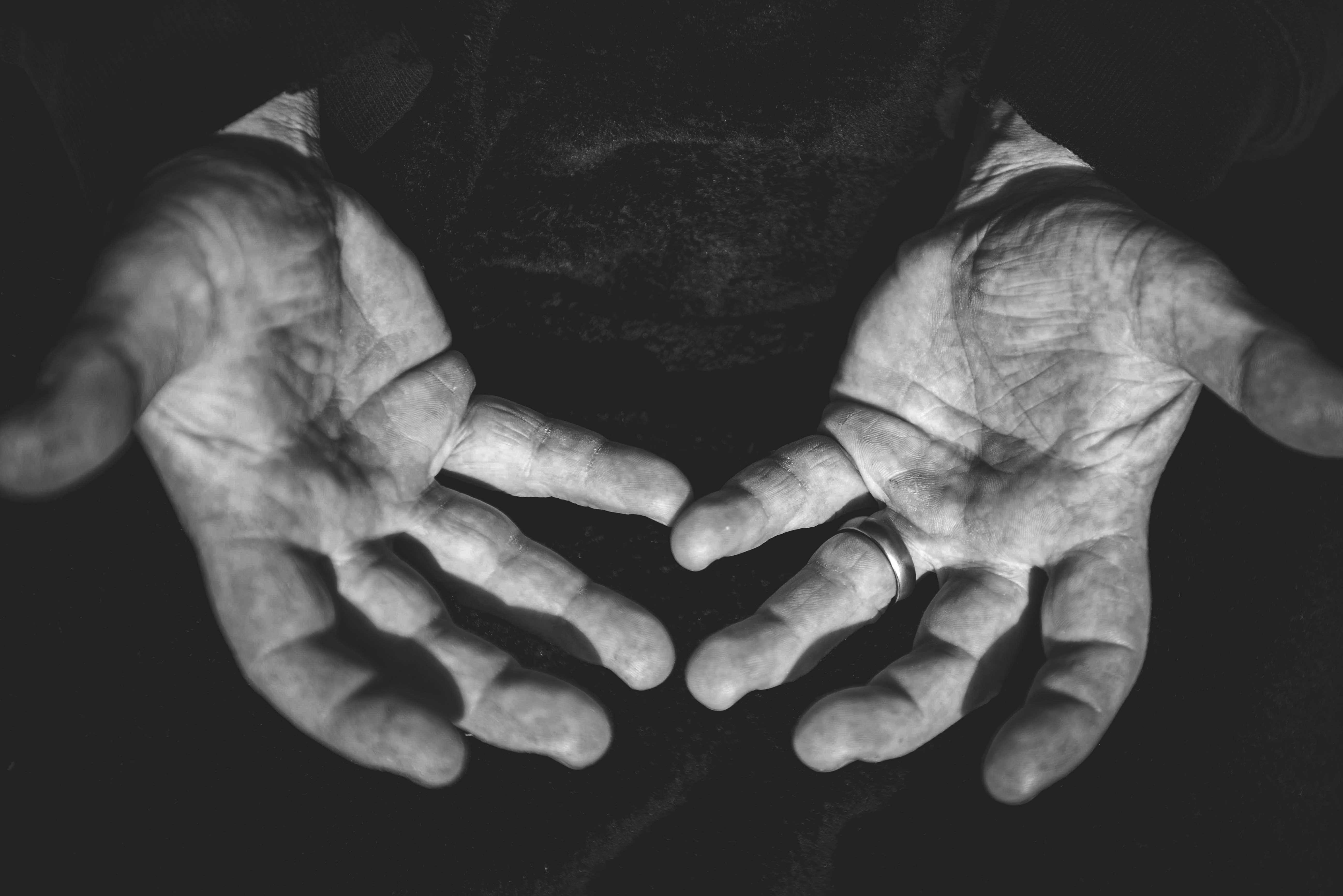 Open Hands: A Quiet Gesture in Monochrome Embrace