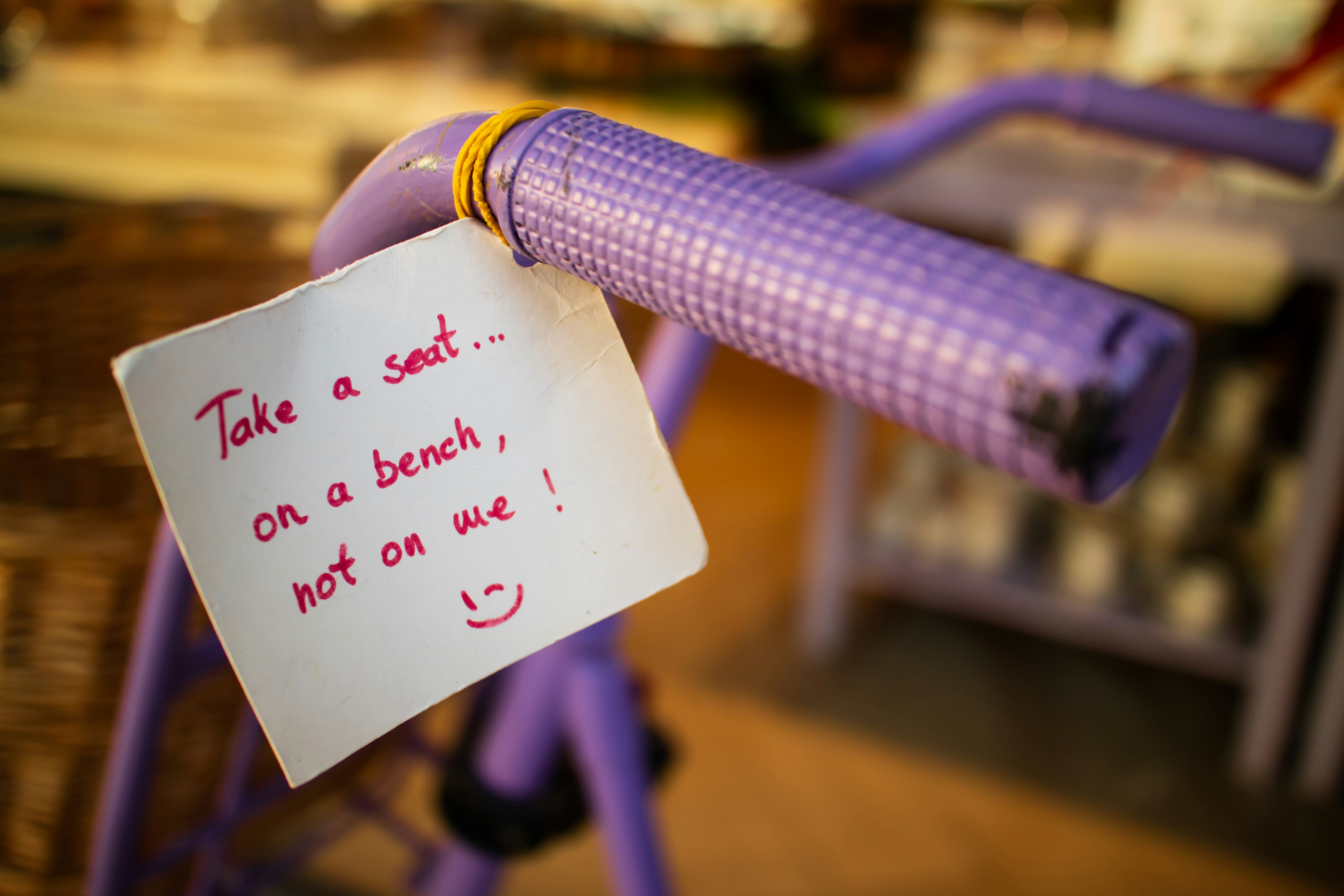 Sign on the Purple Handle: A Playful Note in a Faded Playground