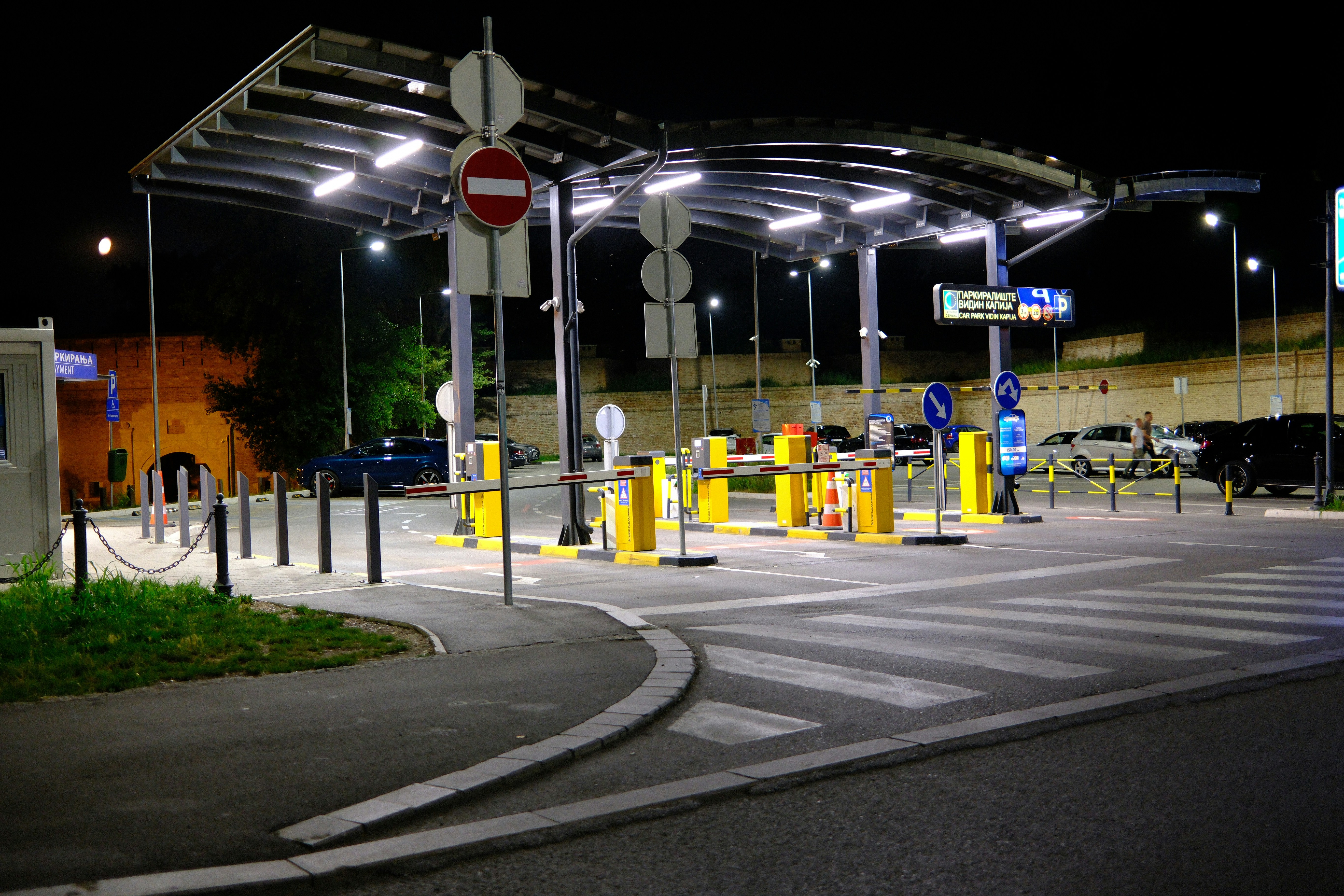 Night Gate: The Illuminated Toll Station Under Empty Skies
