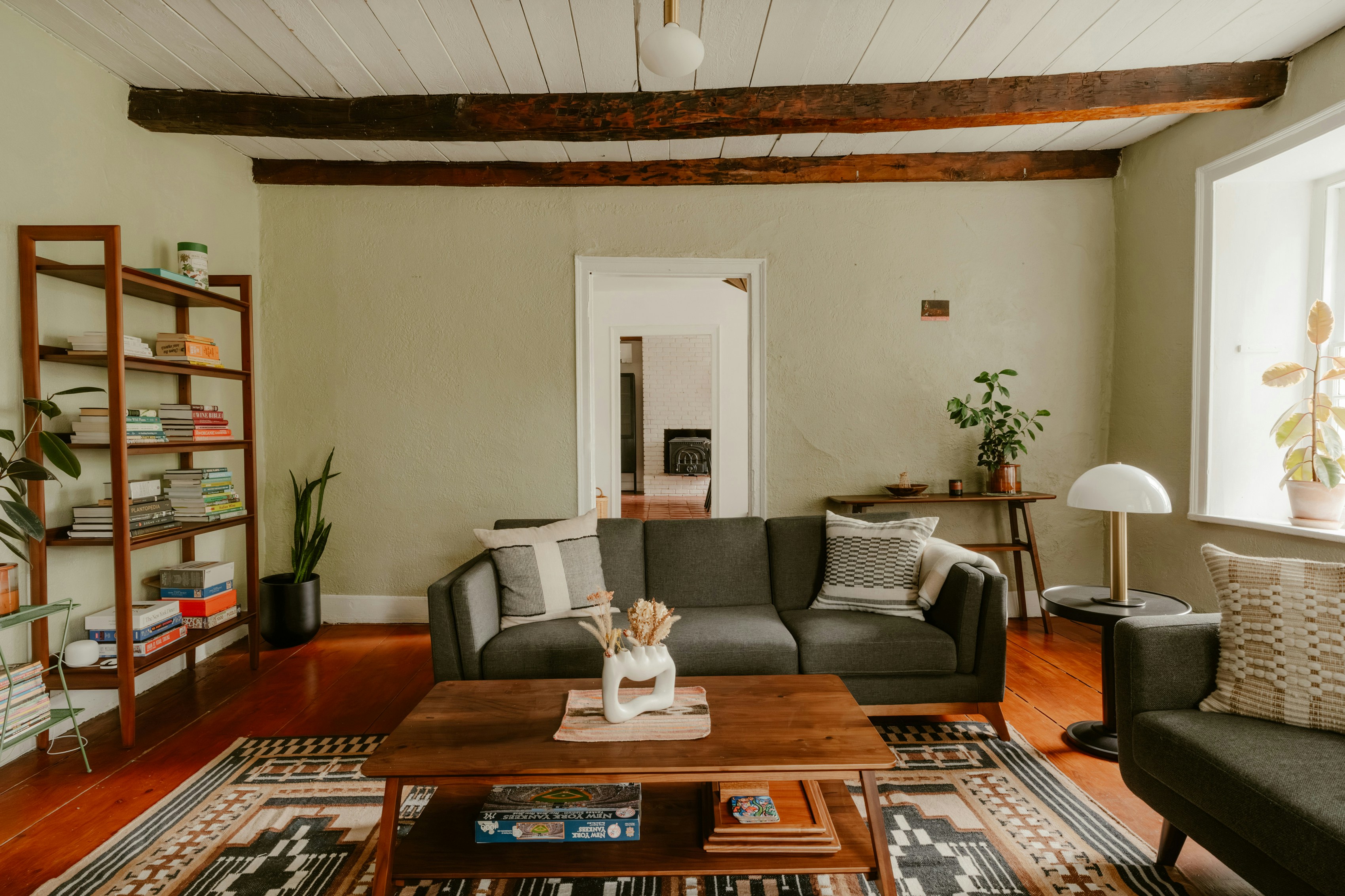 Cozy Studio Lounge With Central Sofa and Warm Wood Accents
