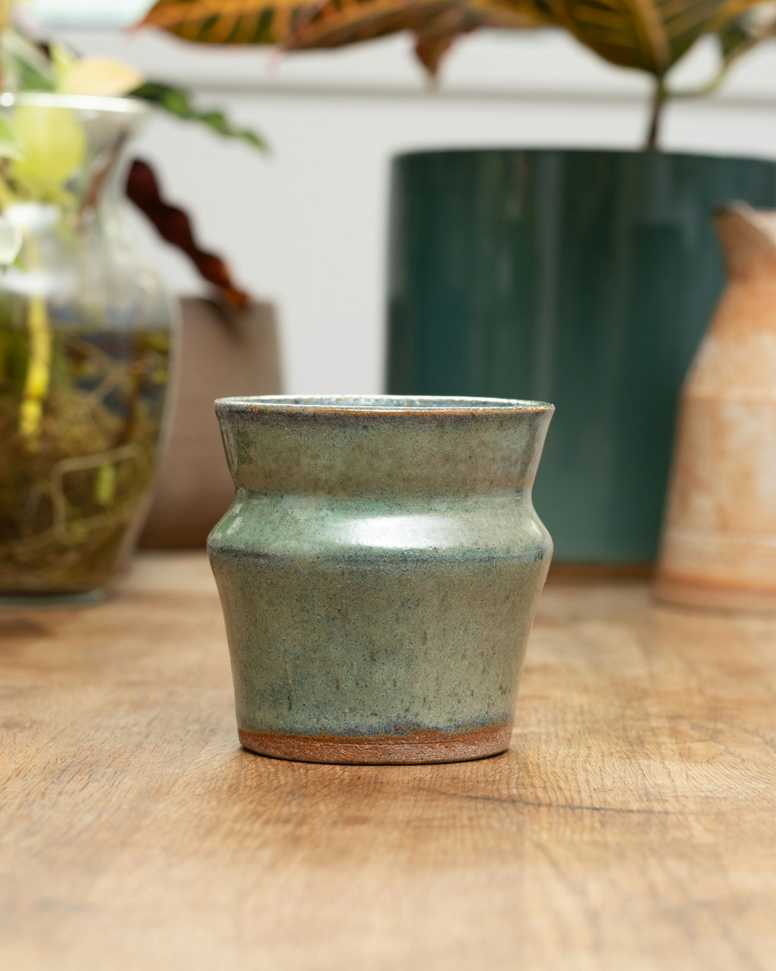 Ceramic Vessel on a Sunny Wood Surface