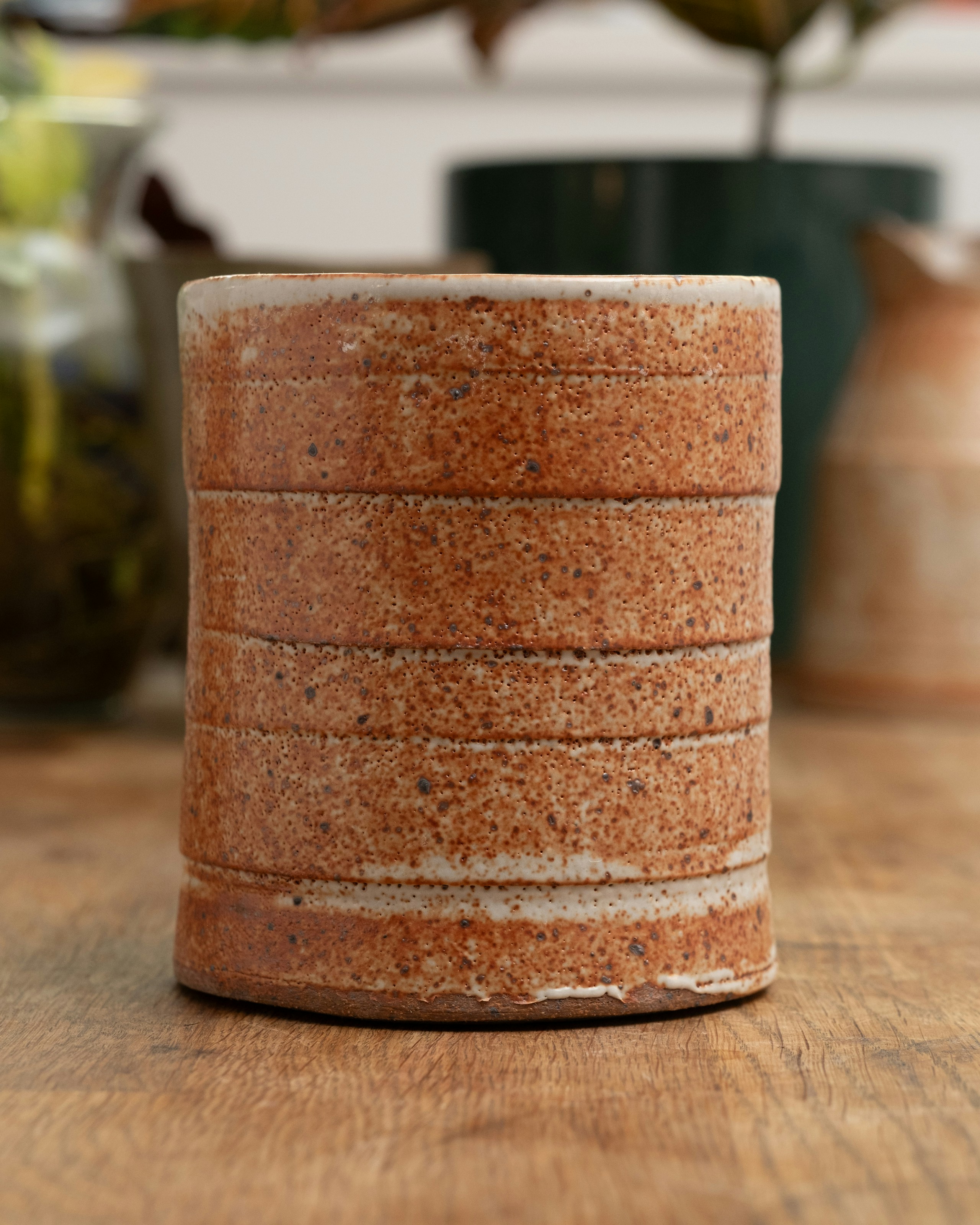 Terracotta Stack on a Weathered Wooden Table
