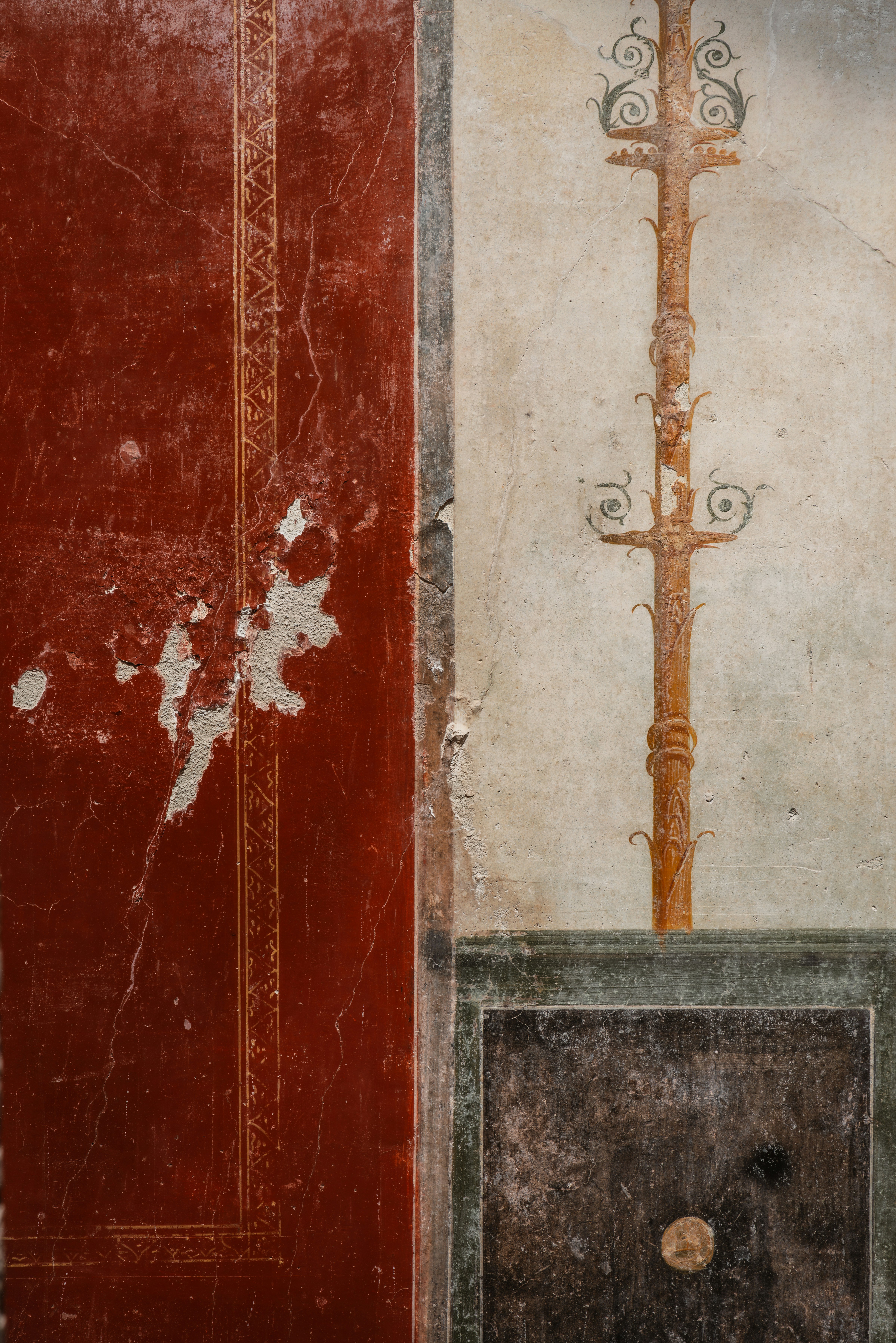 Weathered Doors: A Fragment of Painted Wall Between Red and Beige Panels