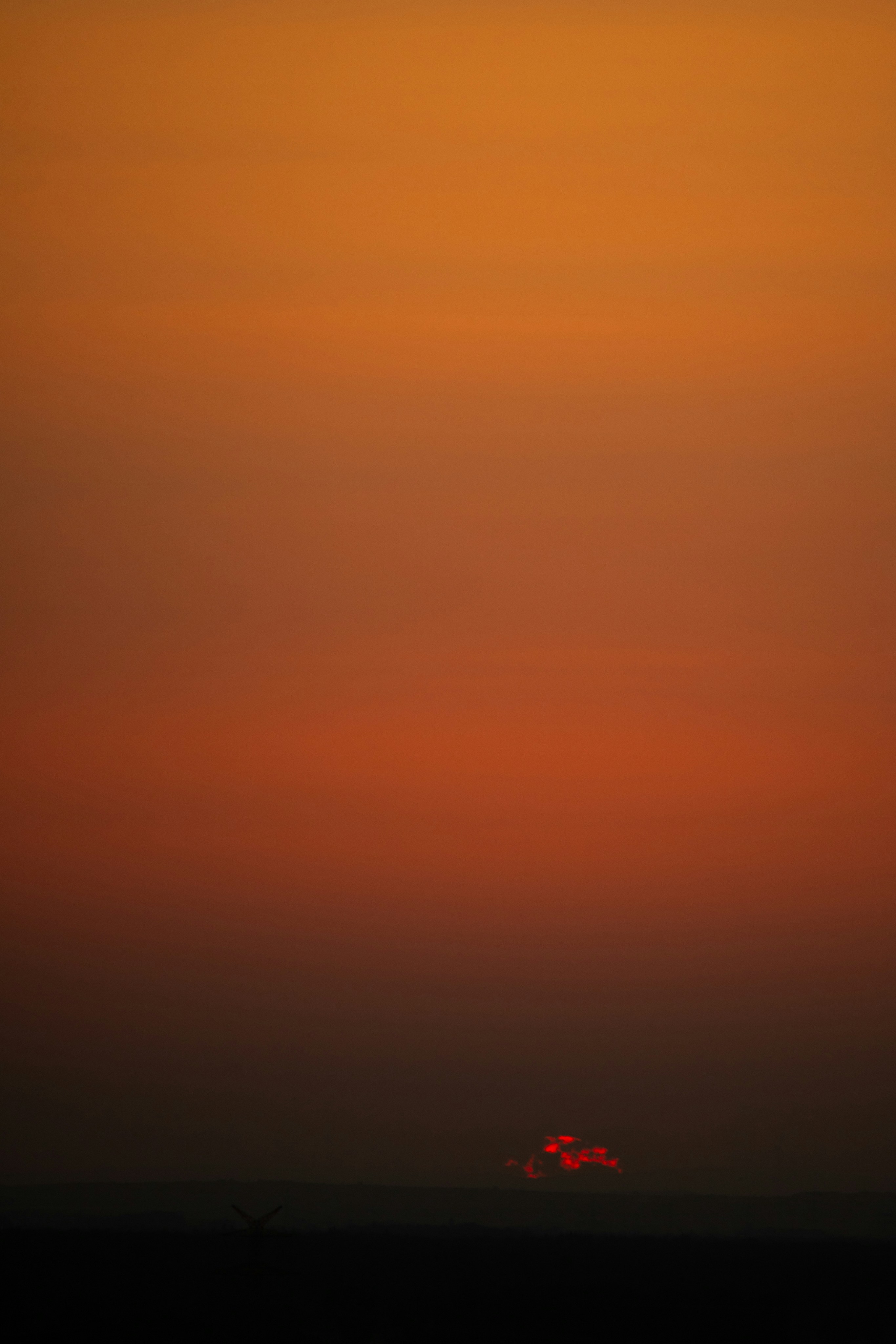 Final Glow Over the Distant Horizon
