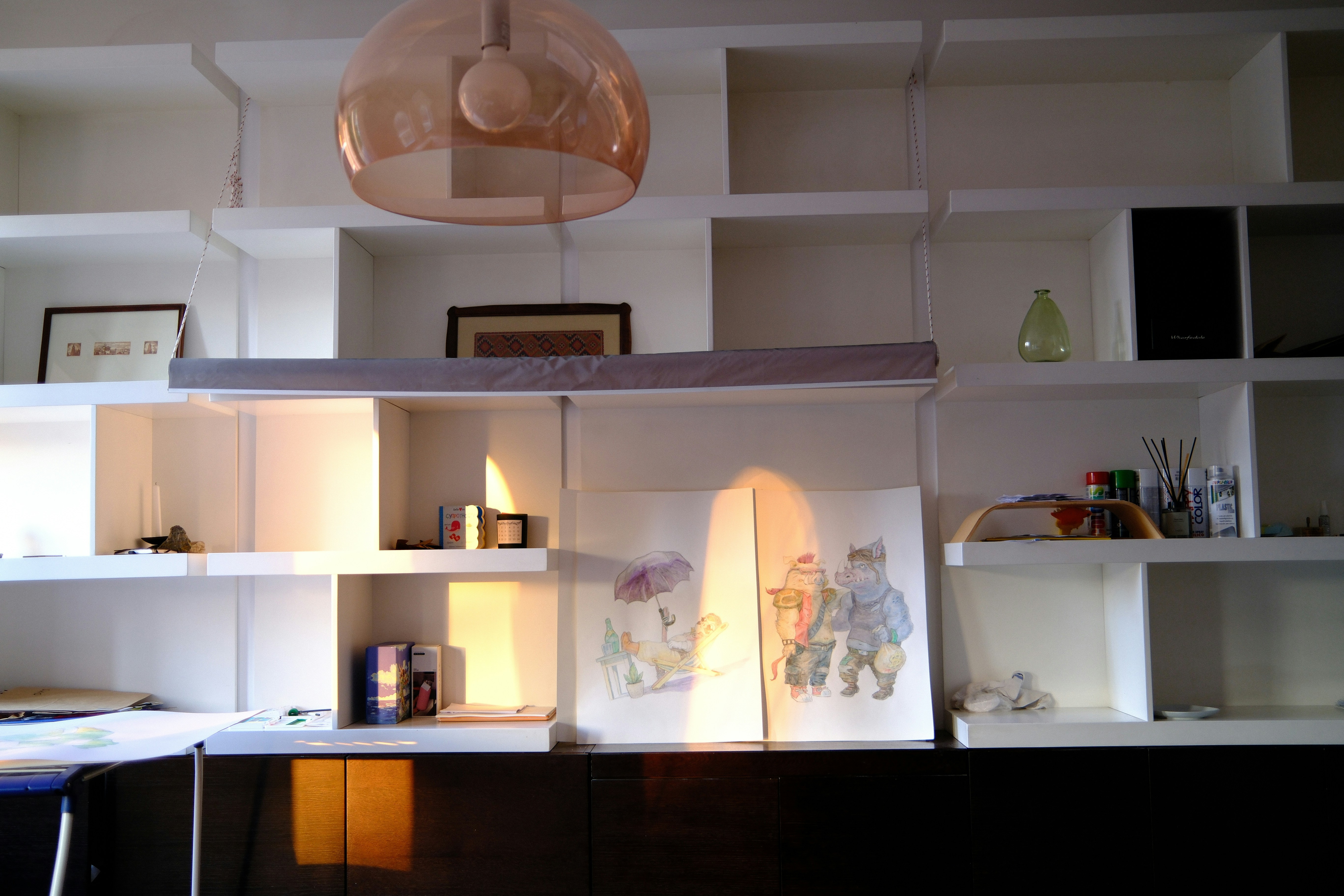 Shadowed Figure in a Quiet Studio Shelf Scene