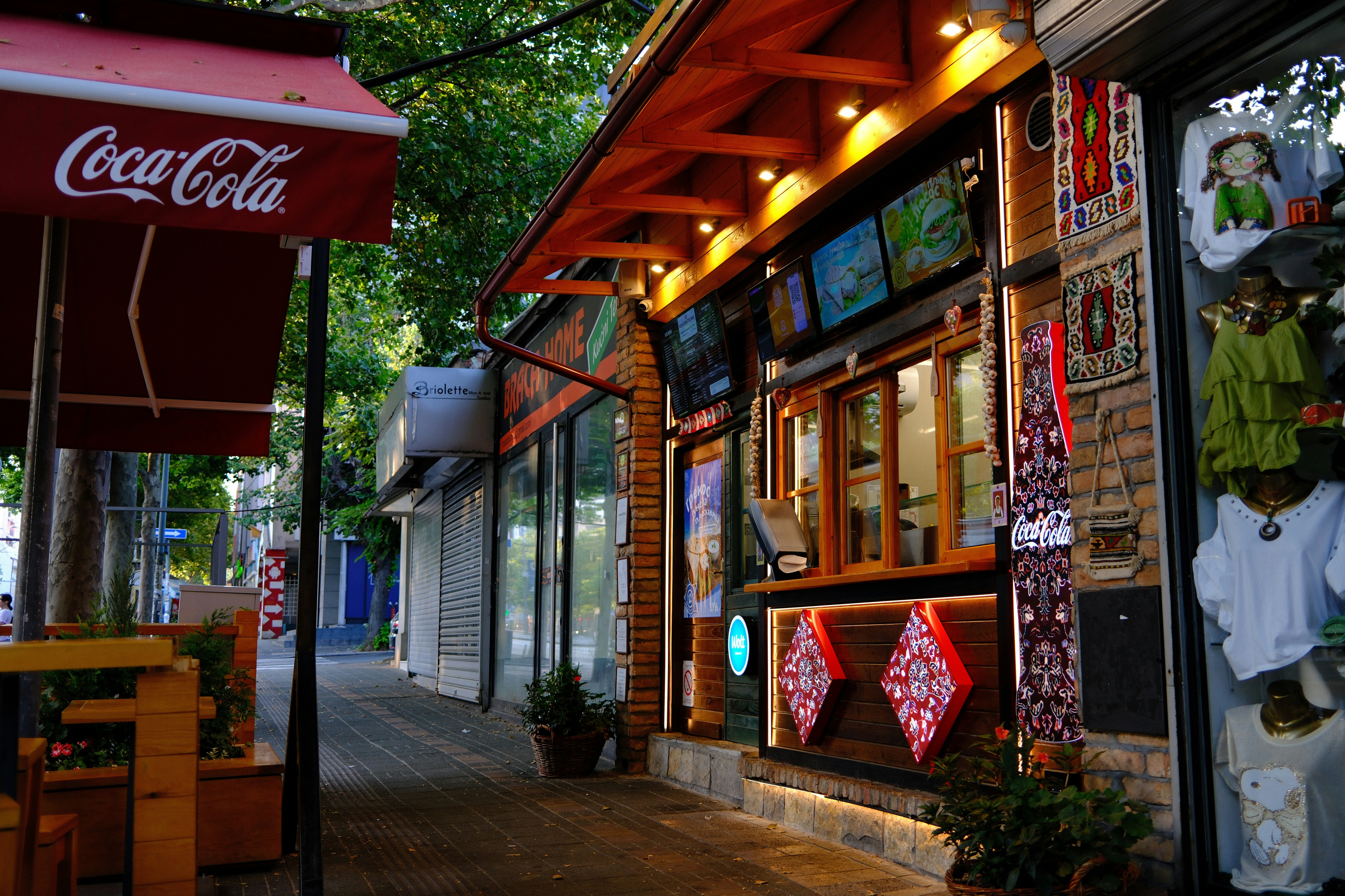 Warm Neon and Timber: A Cozy Streetfront Evening