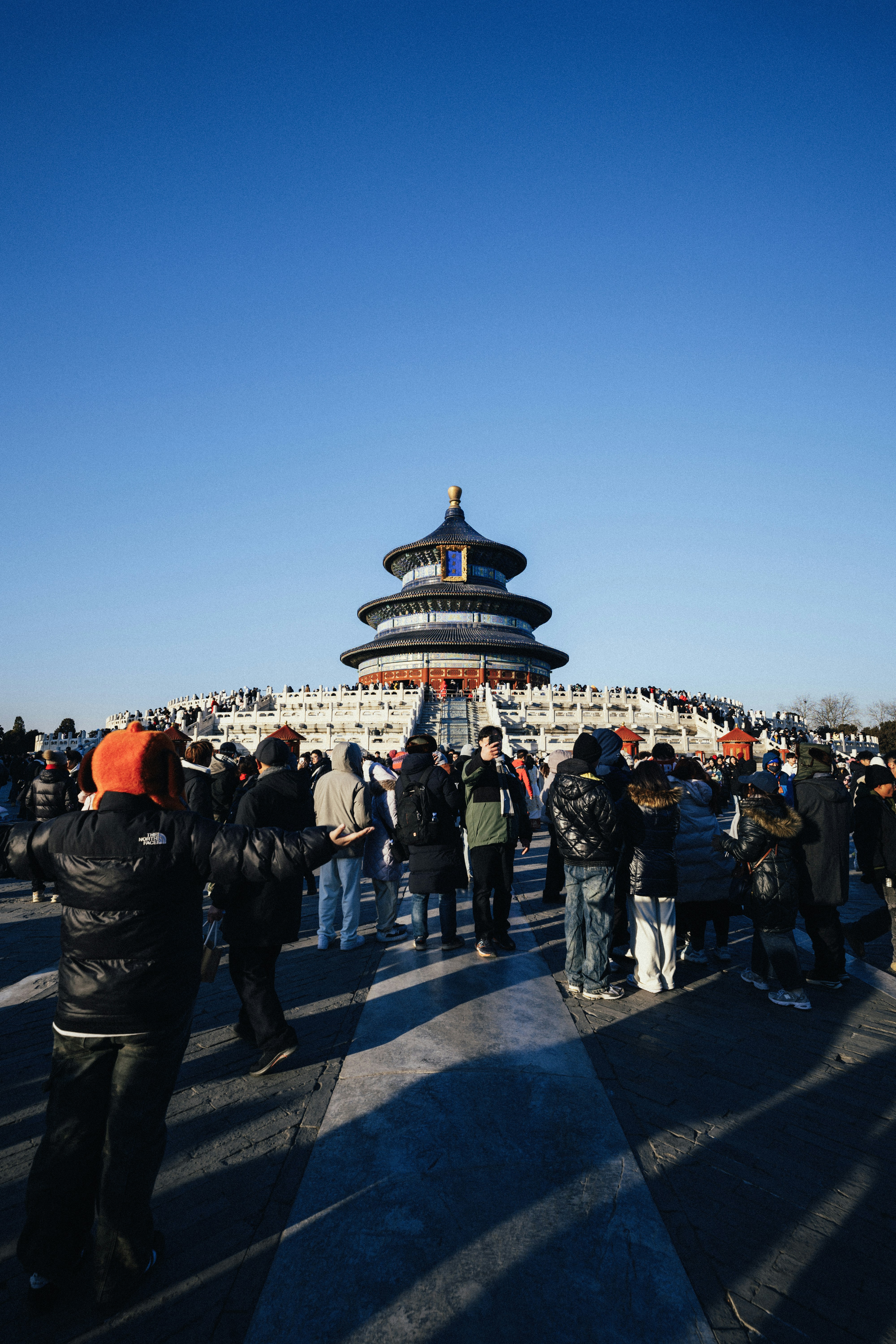 Crowd at the Temple of Heaven under a Clear Sky