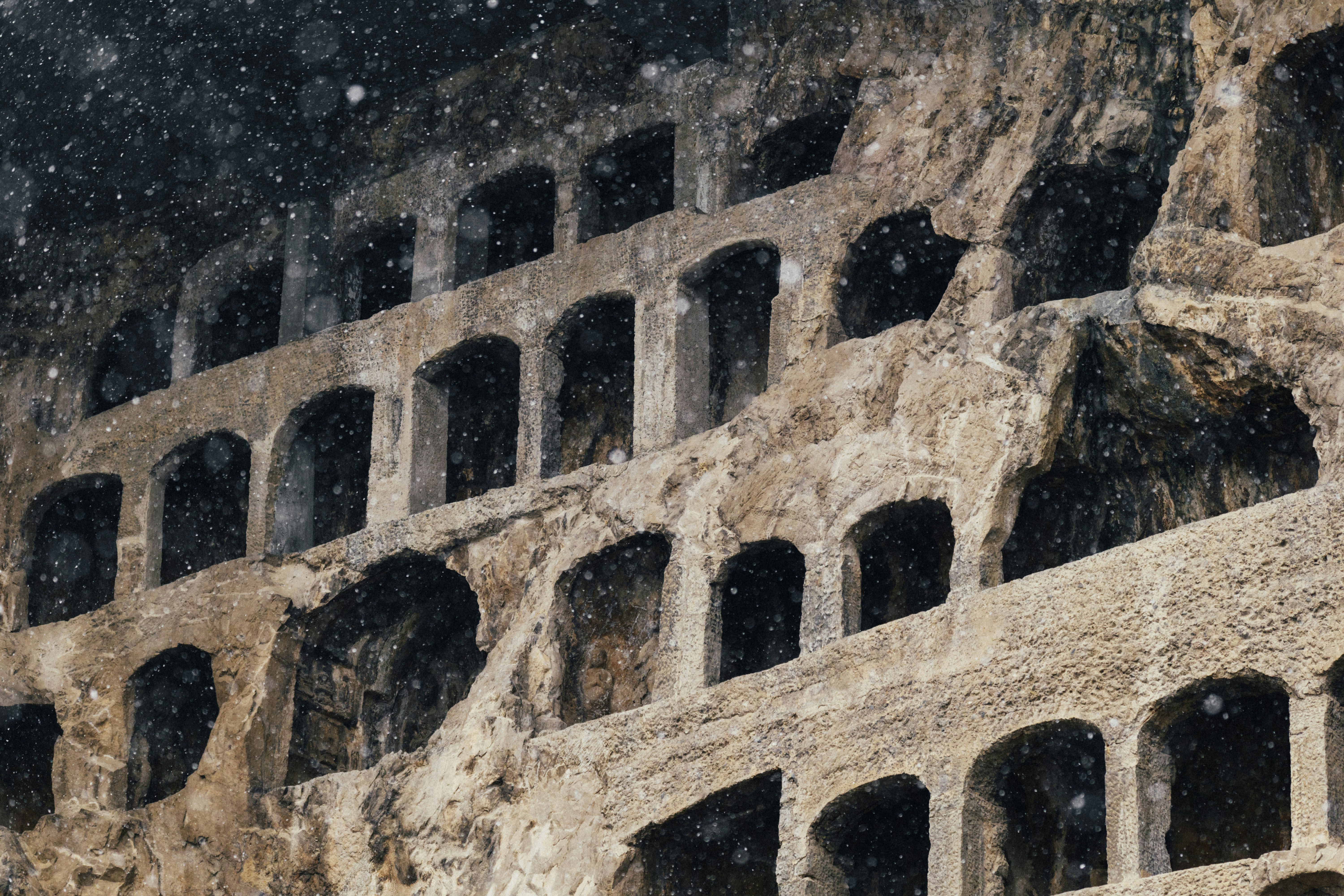 Weathered Arches in Rain: The Echo of Ancient Walls