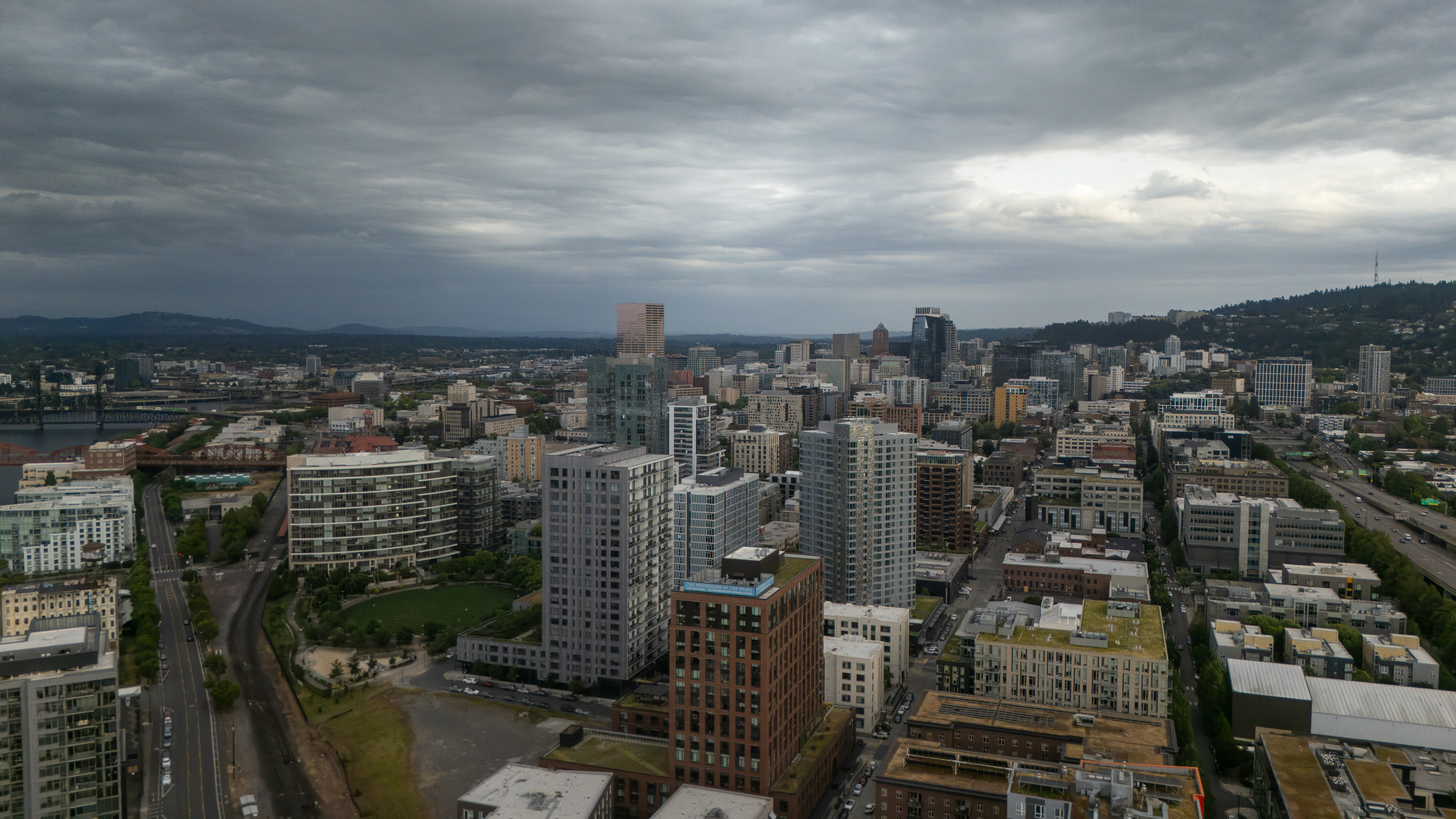 Cloud-veiled Skyline Over a City Grid