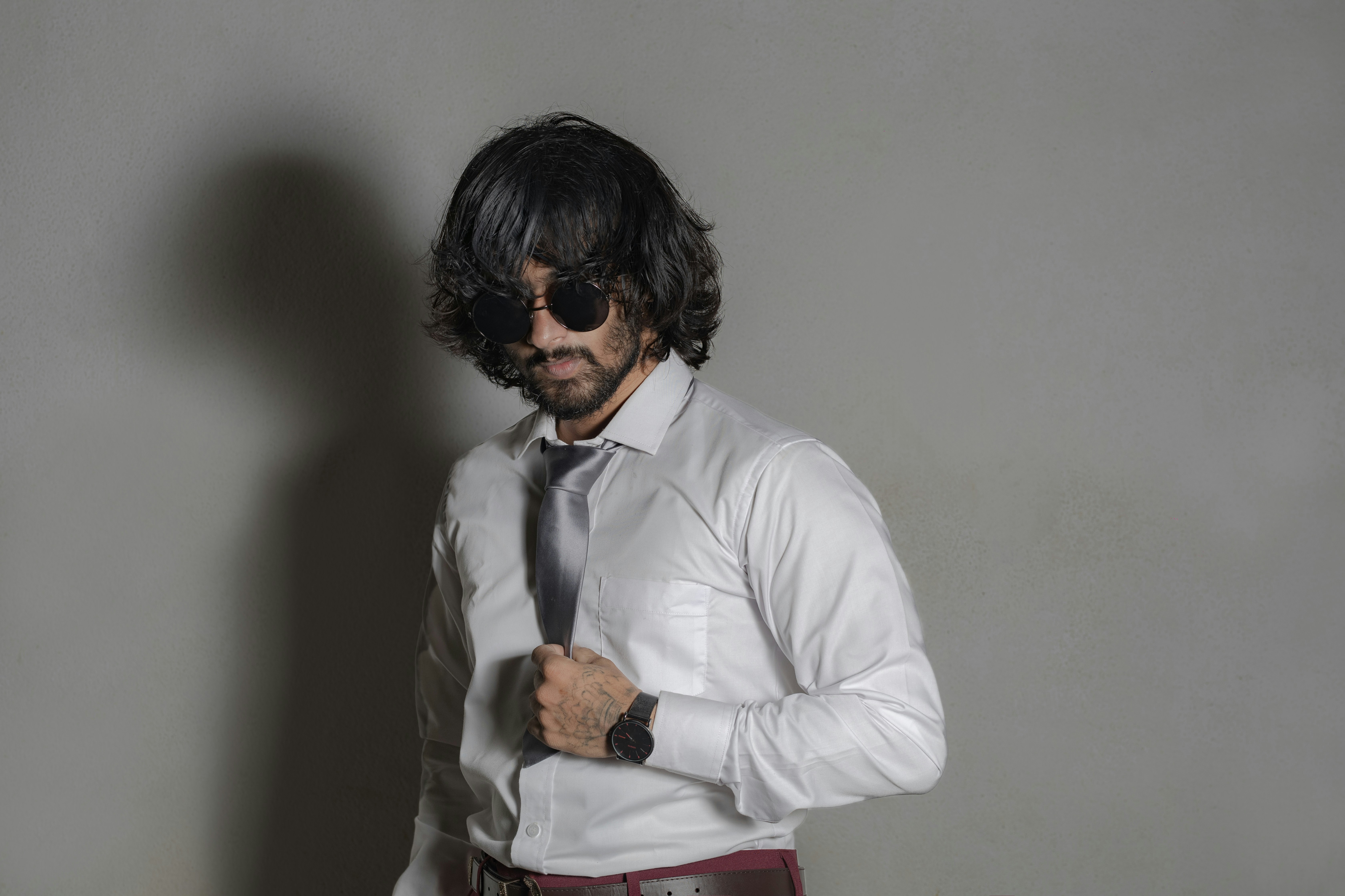 Shadowed Confidence: A Lone Portrait in Soft Studio Light