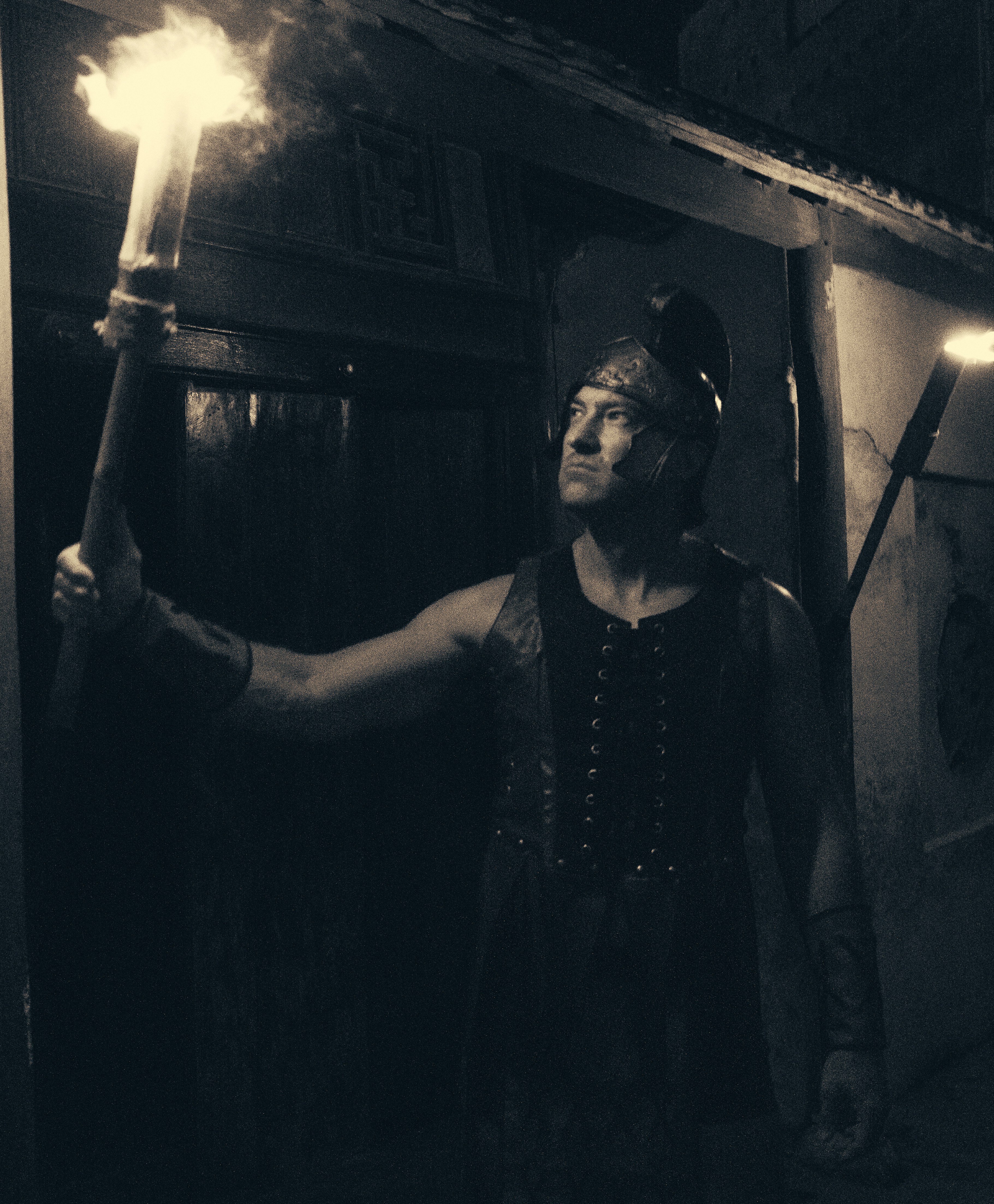 Torchbearer in the Shadowed Corridor