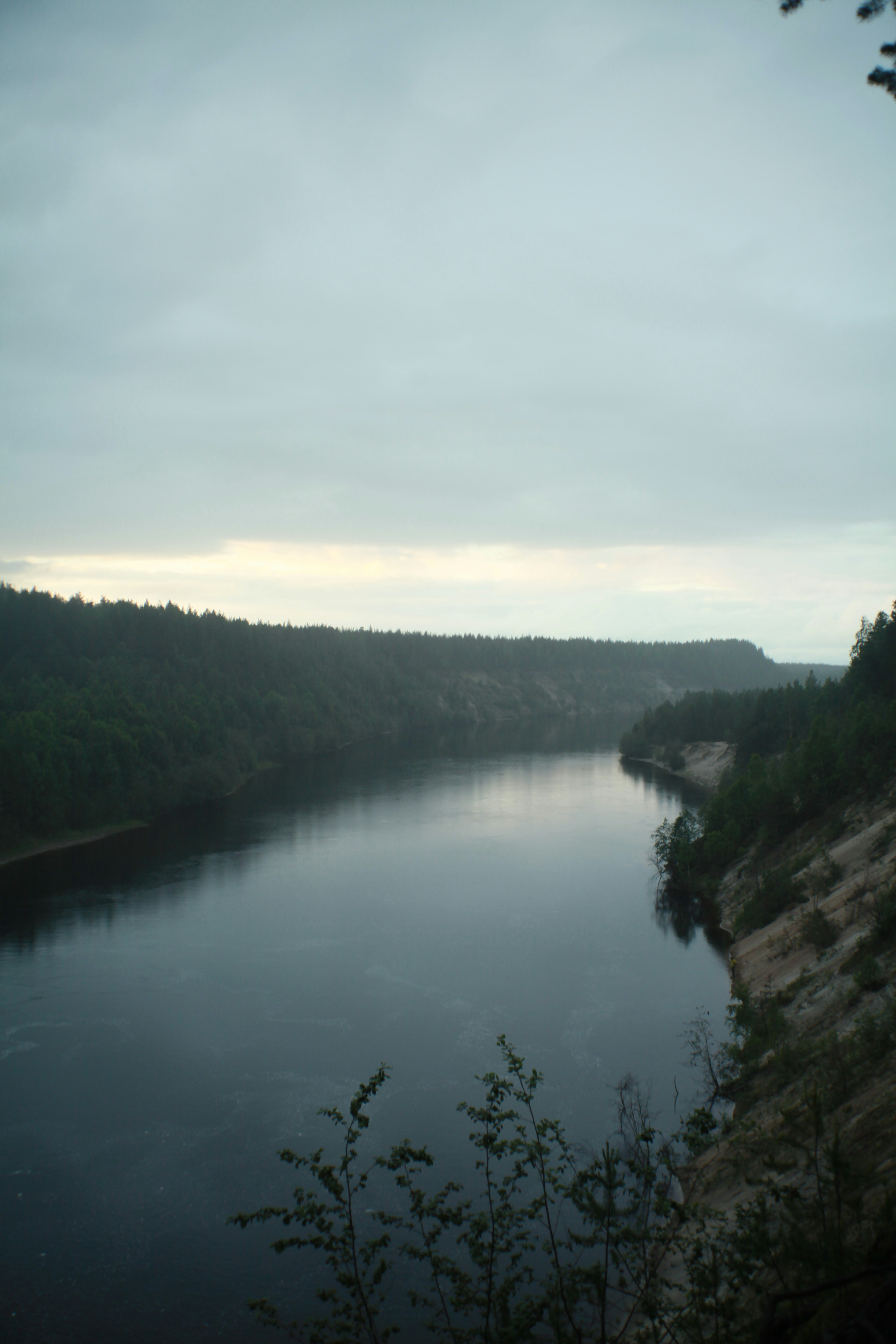 River Valley at Dusk: A Quiet Sweep Between Forested Cliffs