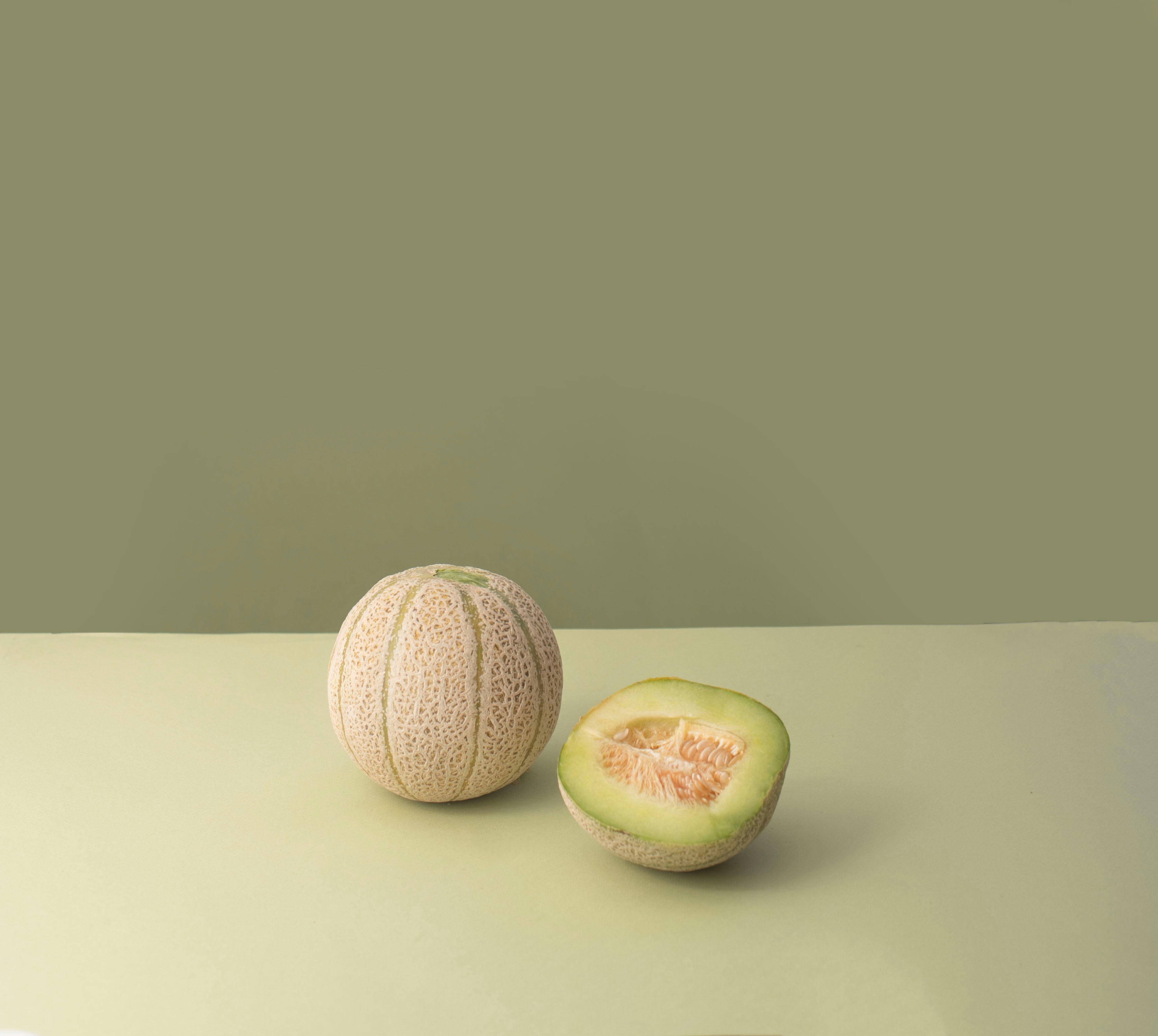 Two Melon Slices on a Pale Table: Quiet Minimalism
