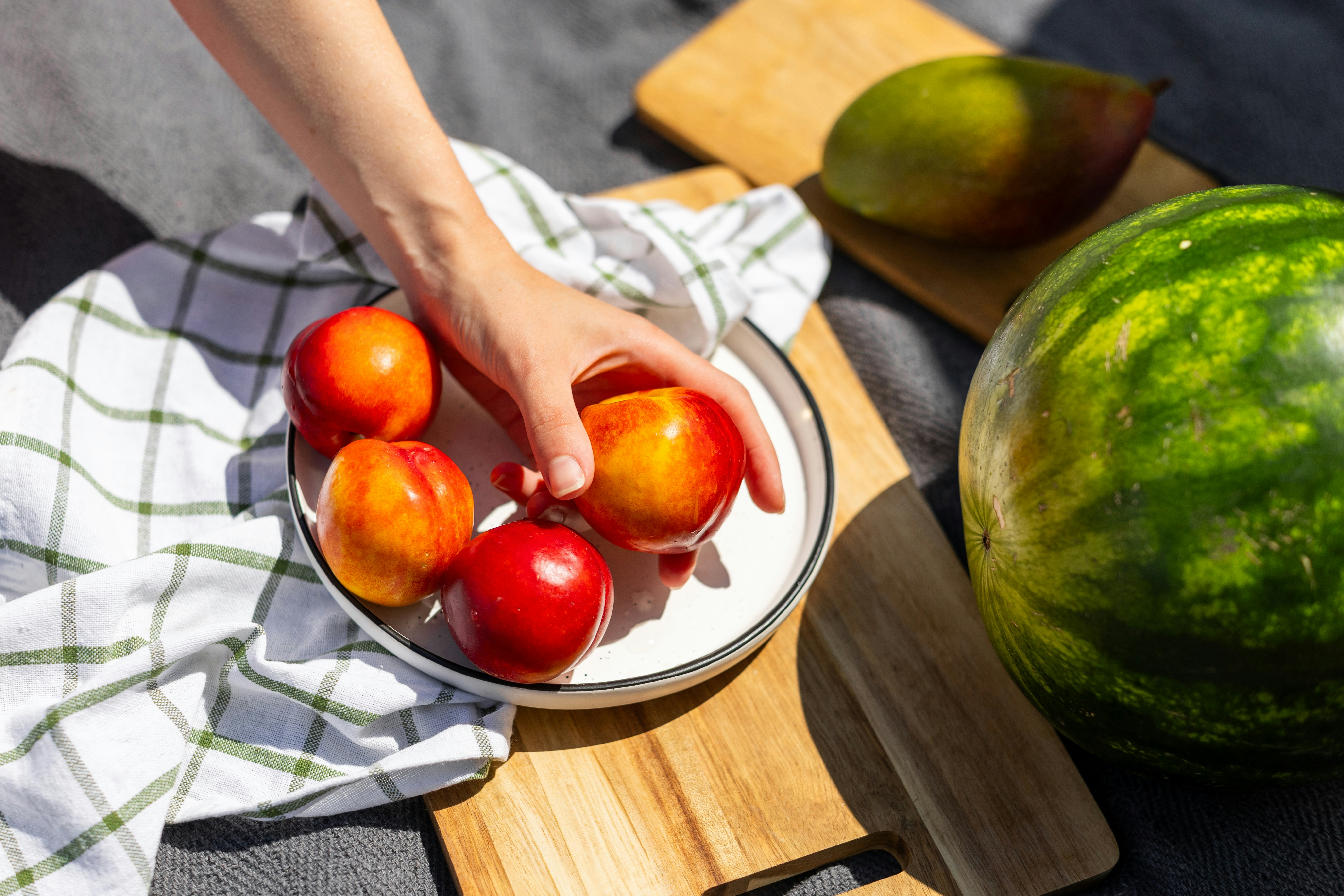 Peaches and Watermelon Slice: Fresh Market Still Life in Sunlit Outdoor Kitchen