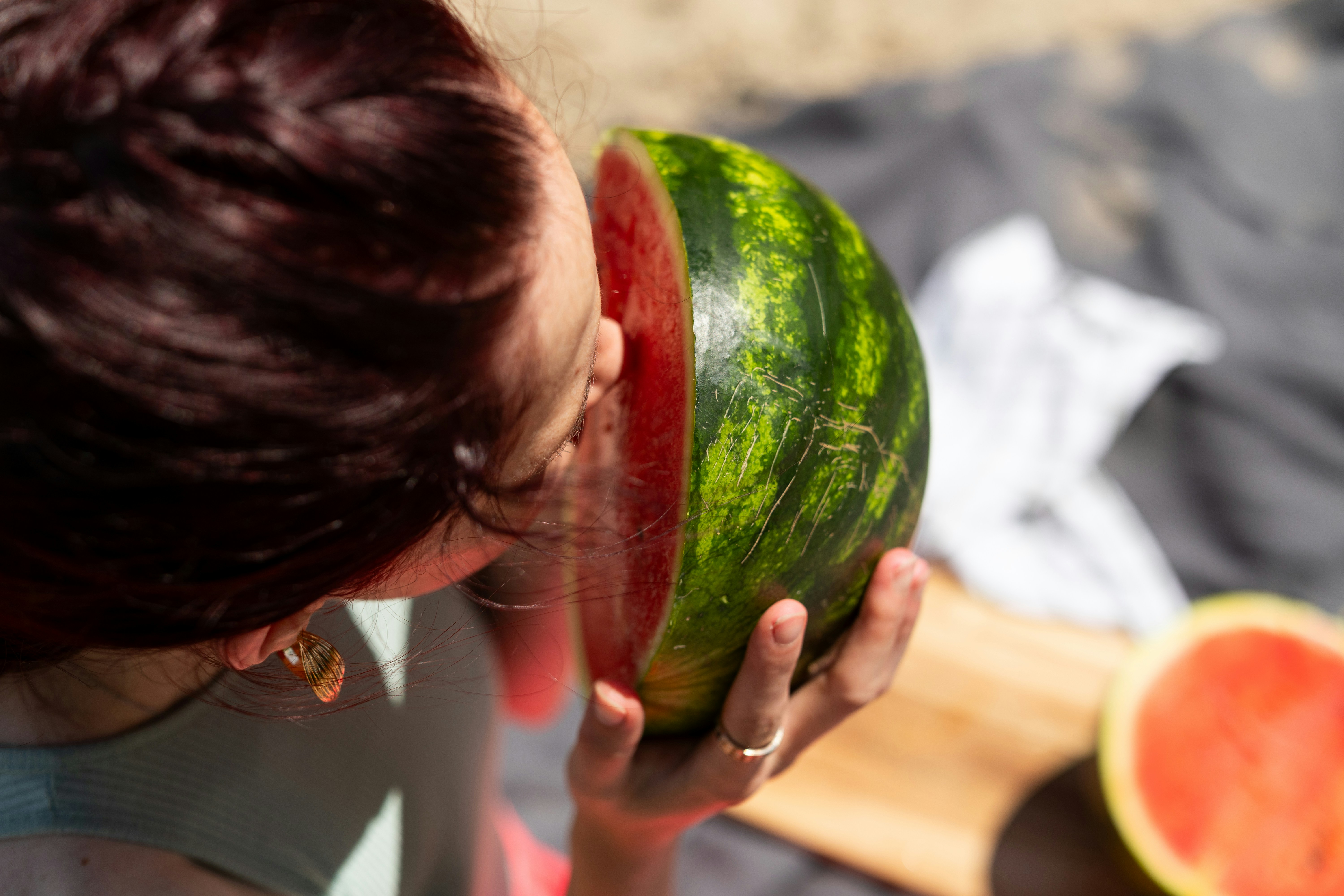 Watermelon Bite: A Cool Moment in Bright Lighting