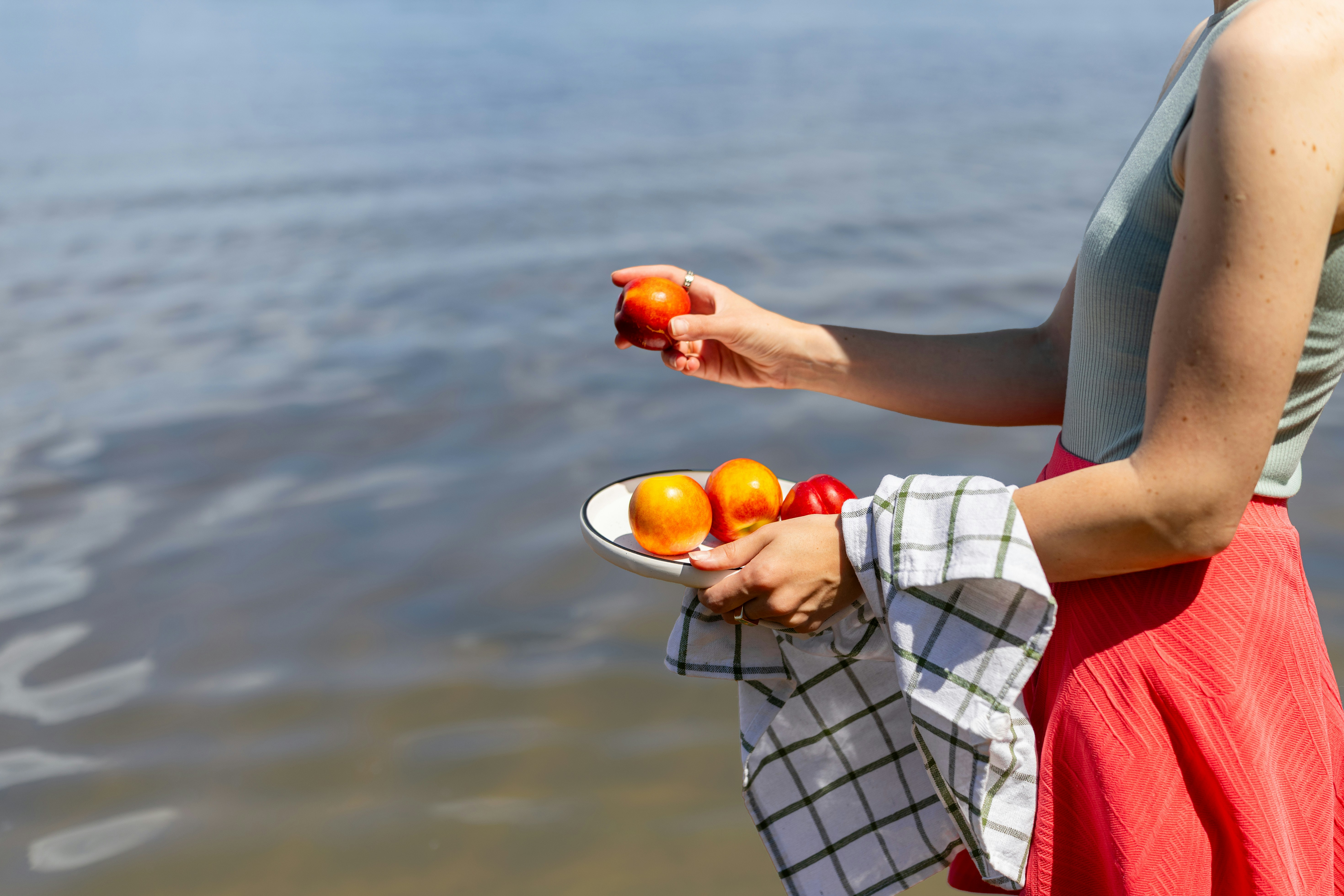Bright Red Skirt, Fresh Peaches: A Shoreline Harvest Portrait