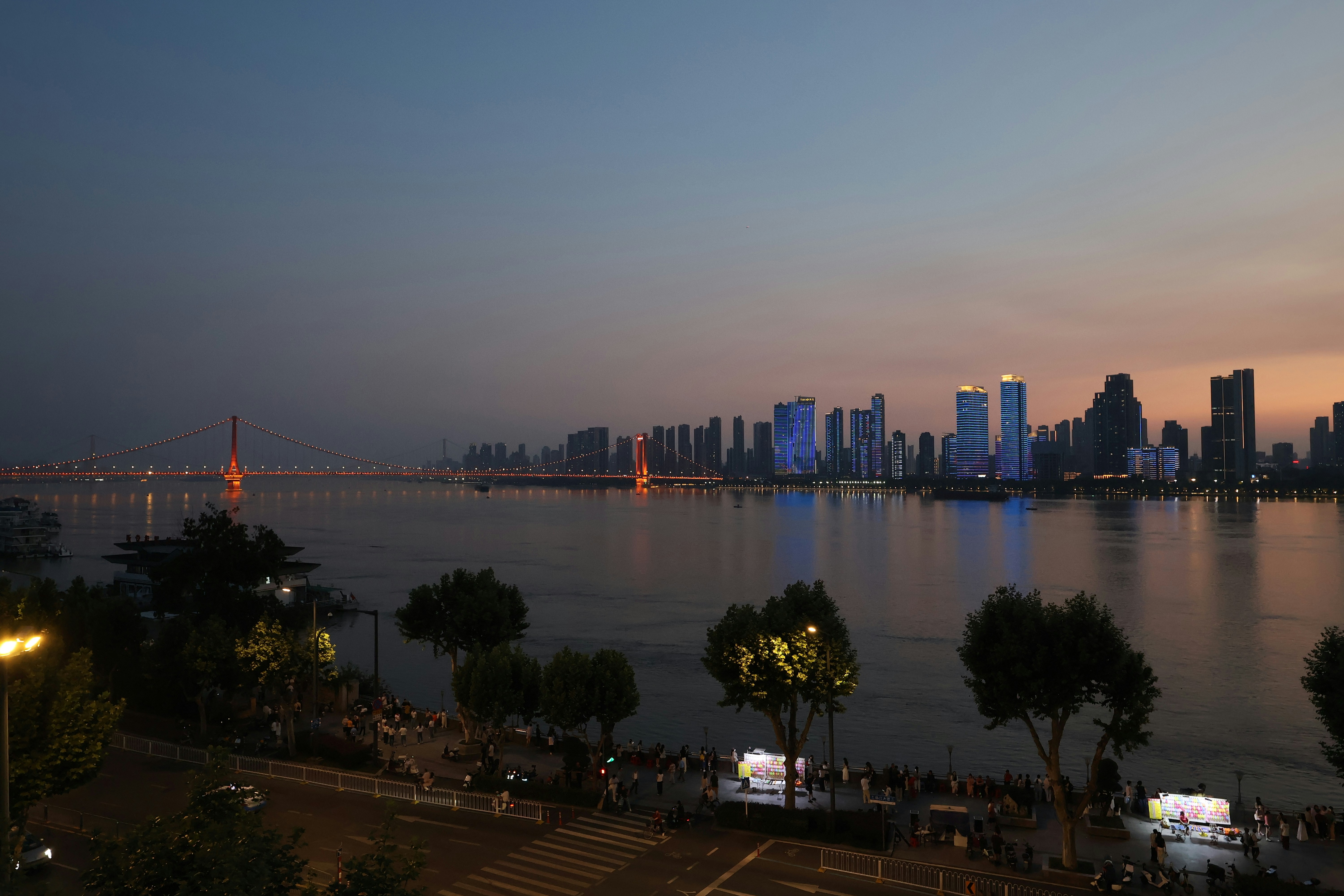 Evening Pearl: City Lights Reflected on the River
