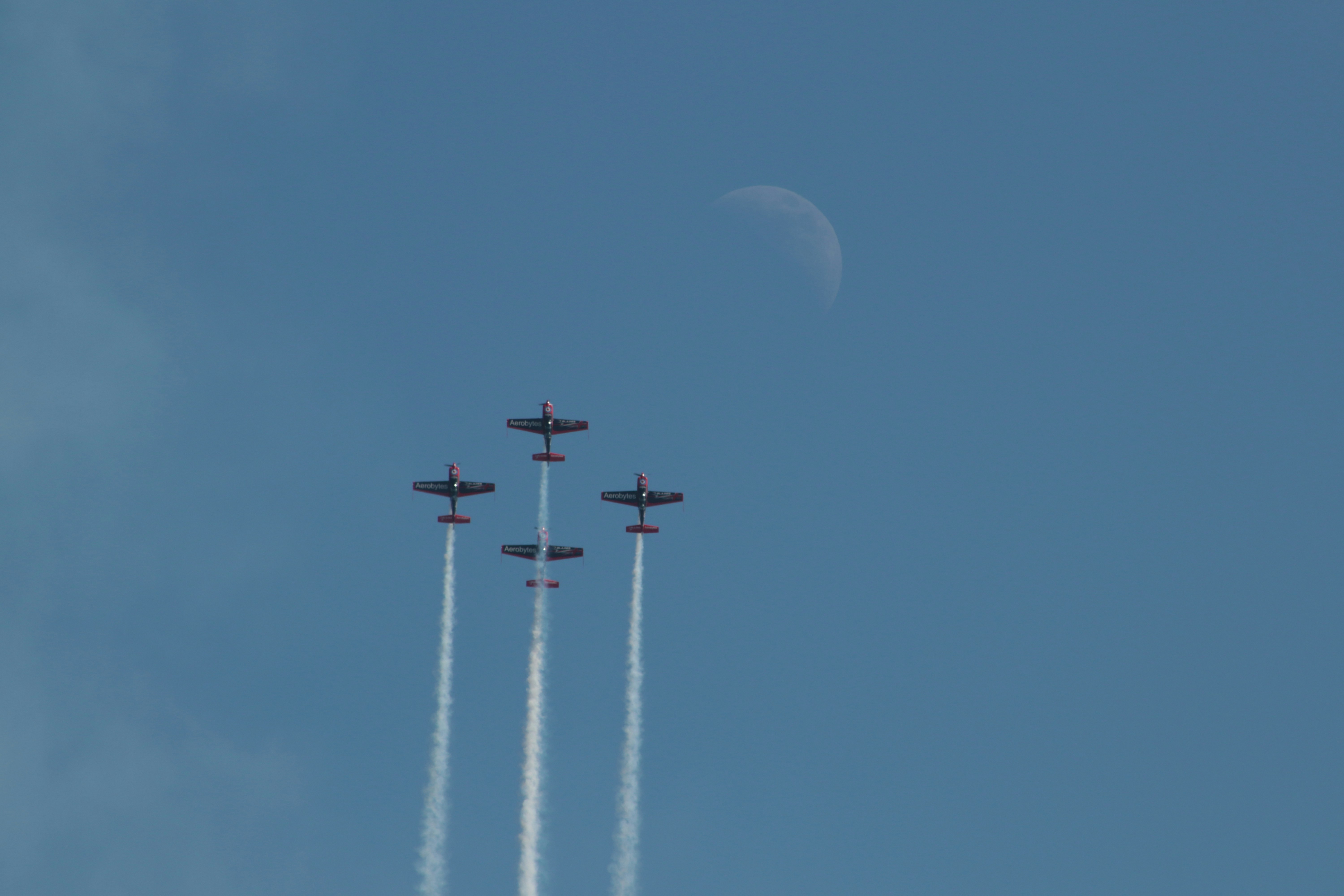 Four-Plane Sky Parade: Jet Team in Clear Blue Arc