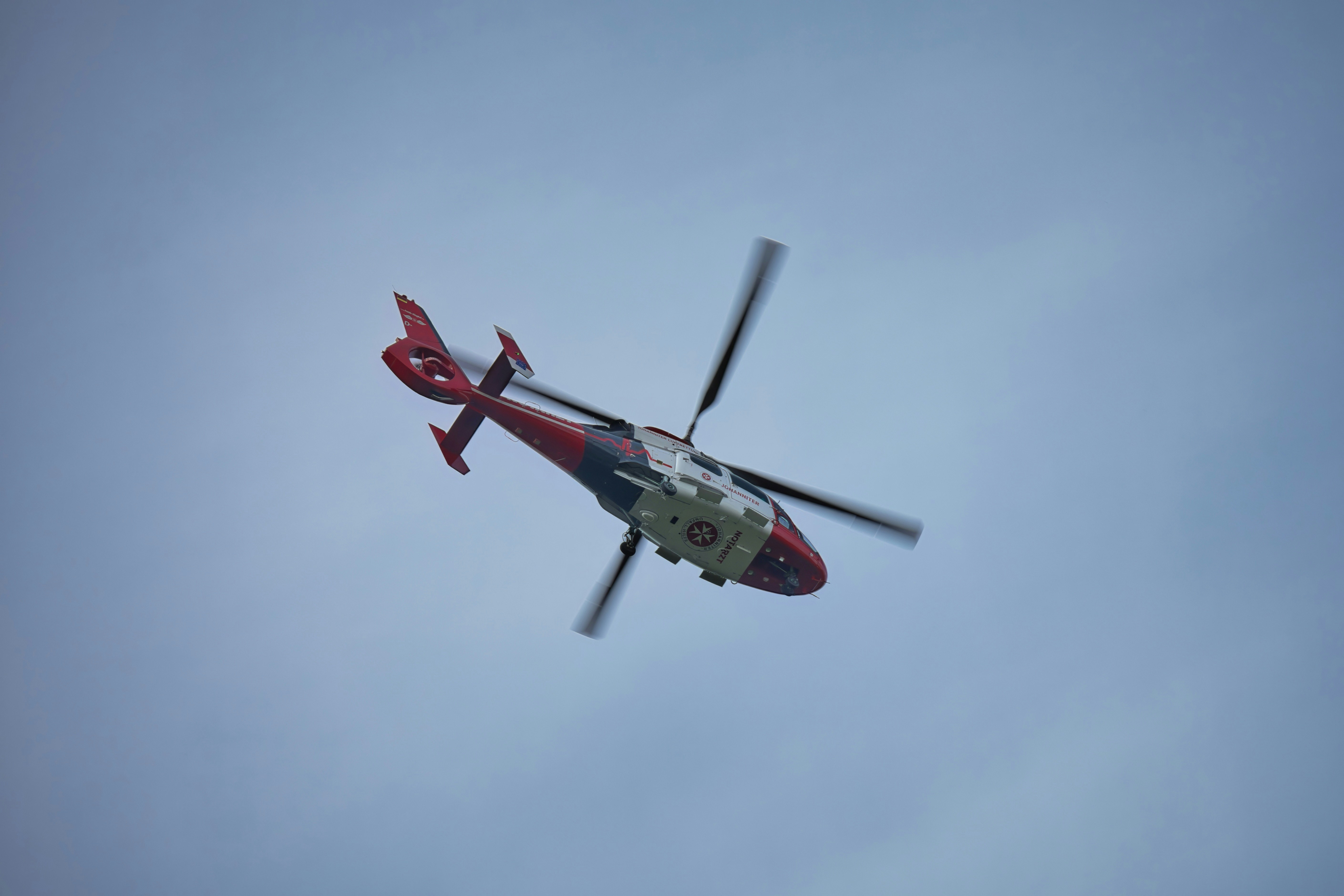 Red Rescue Helicopter in a Quiet Sky