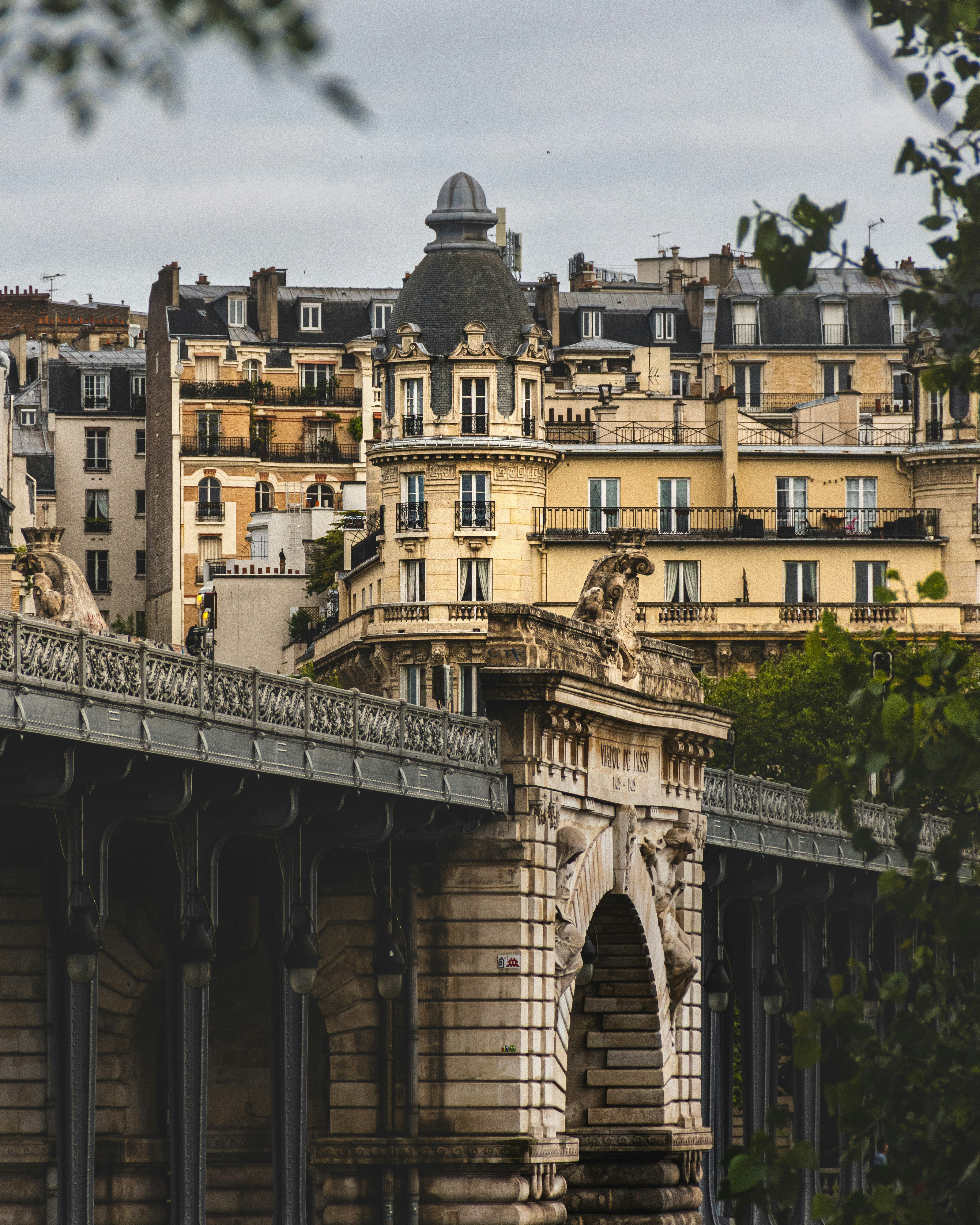 Arched Parisian Approach: The Bridge and Mansard Facades