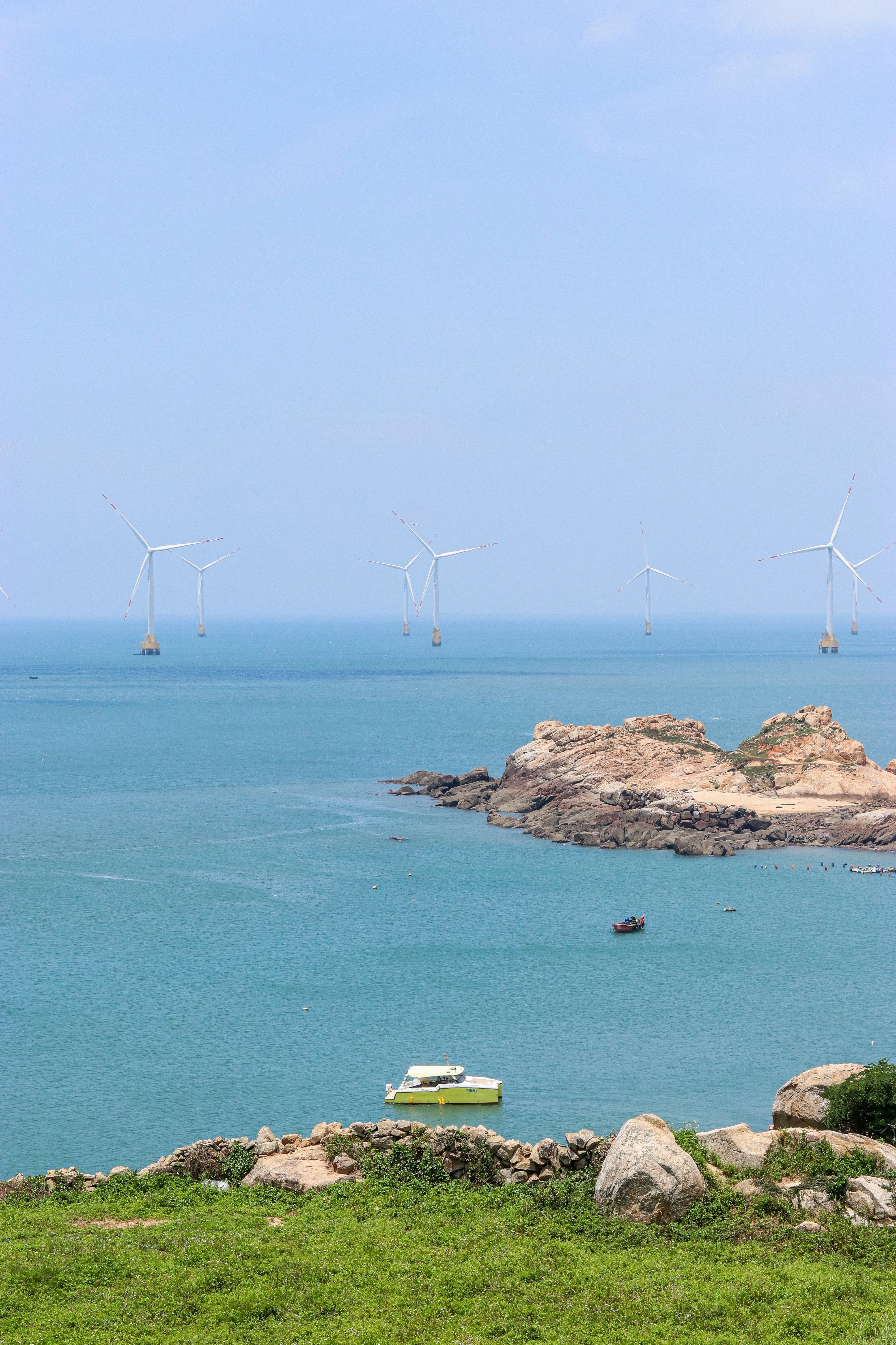 Wind Farm at the Edge: Coastal Rocks Meet Ocean Currents