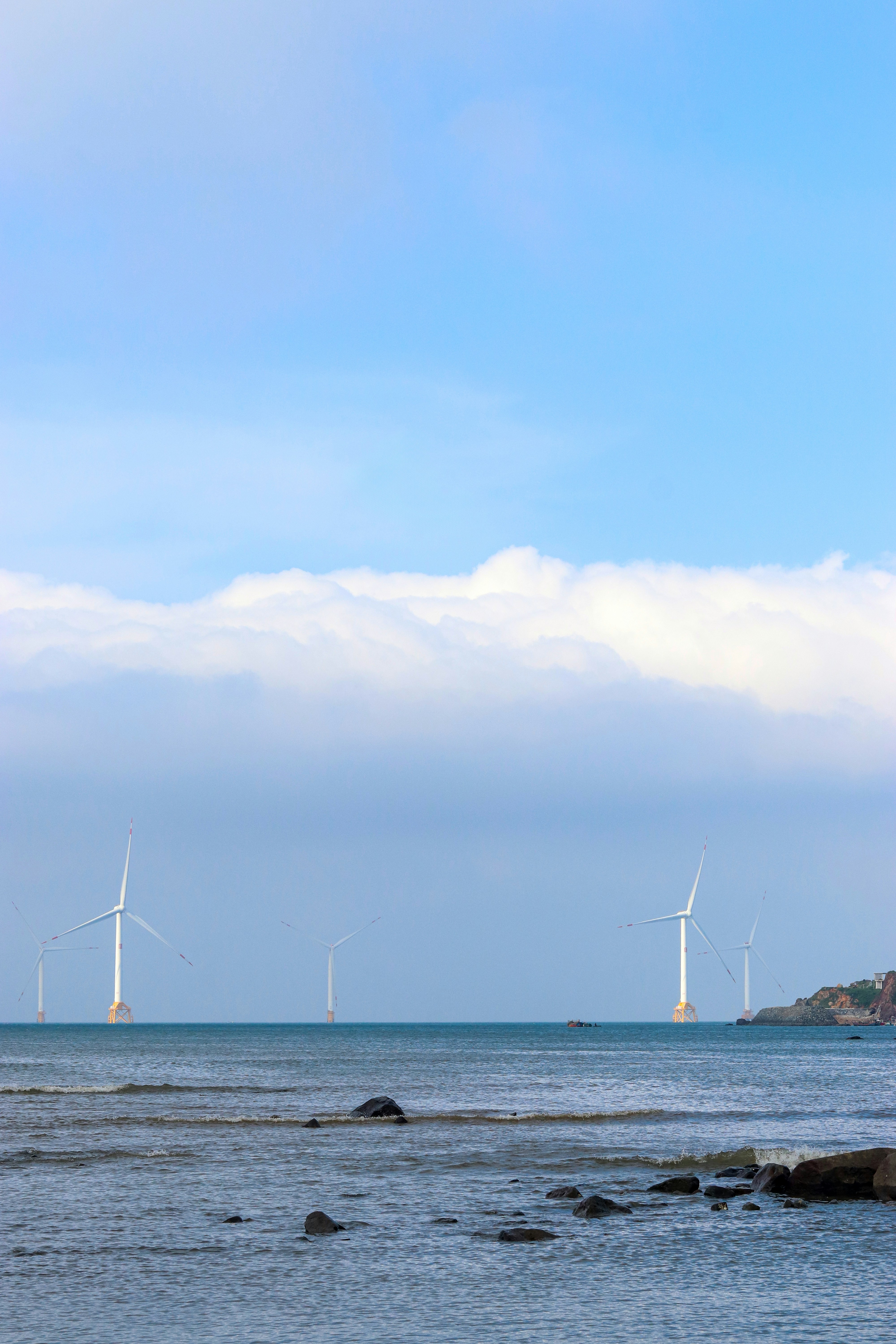 Sea Sky Gazers: Wind Turbines on the Horizon