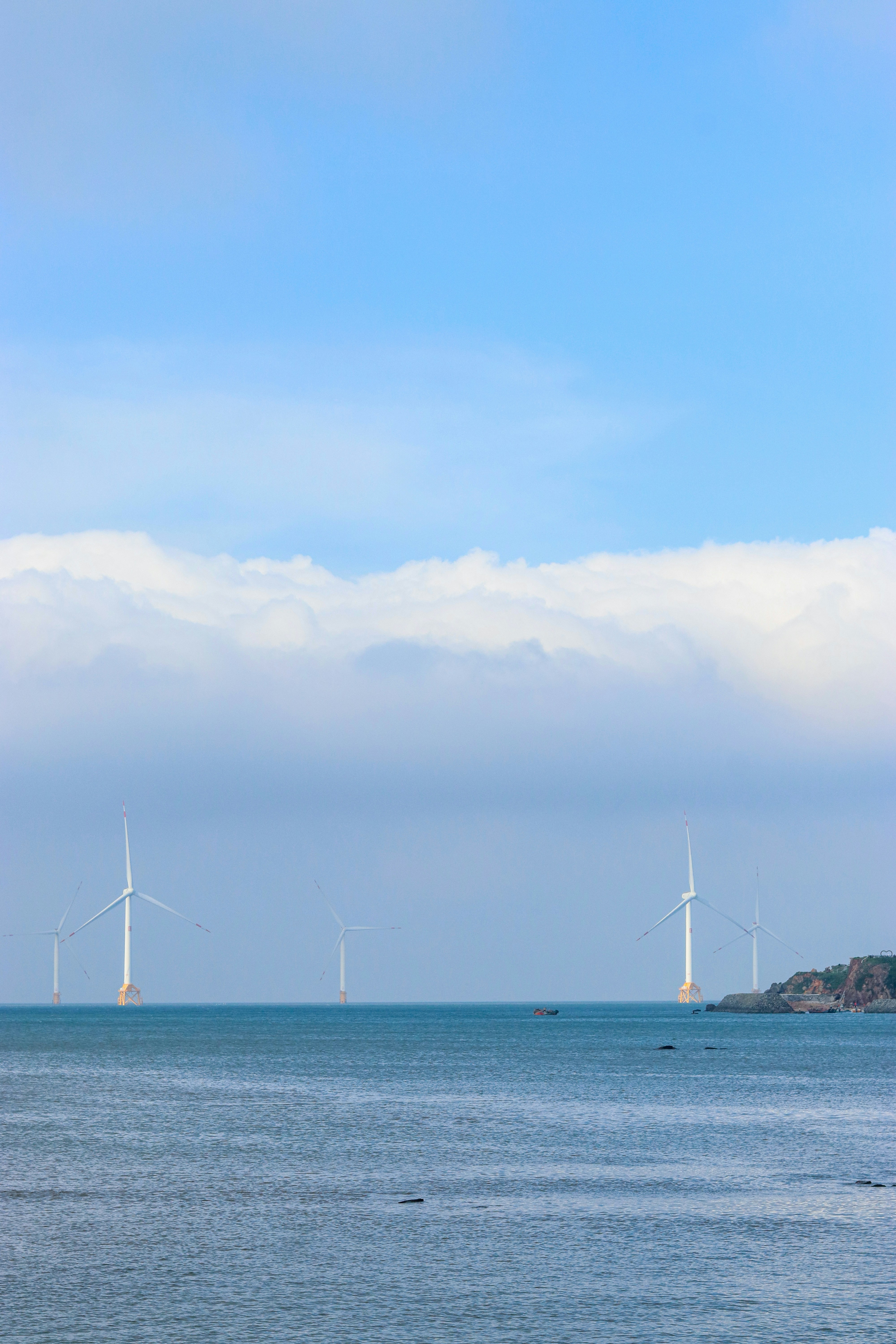 Seaborne Giants: Offshore Wind Turbines Framing a Quiet Horizon