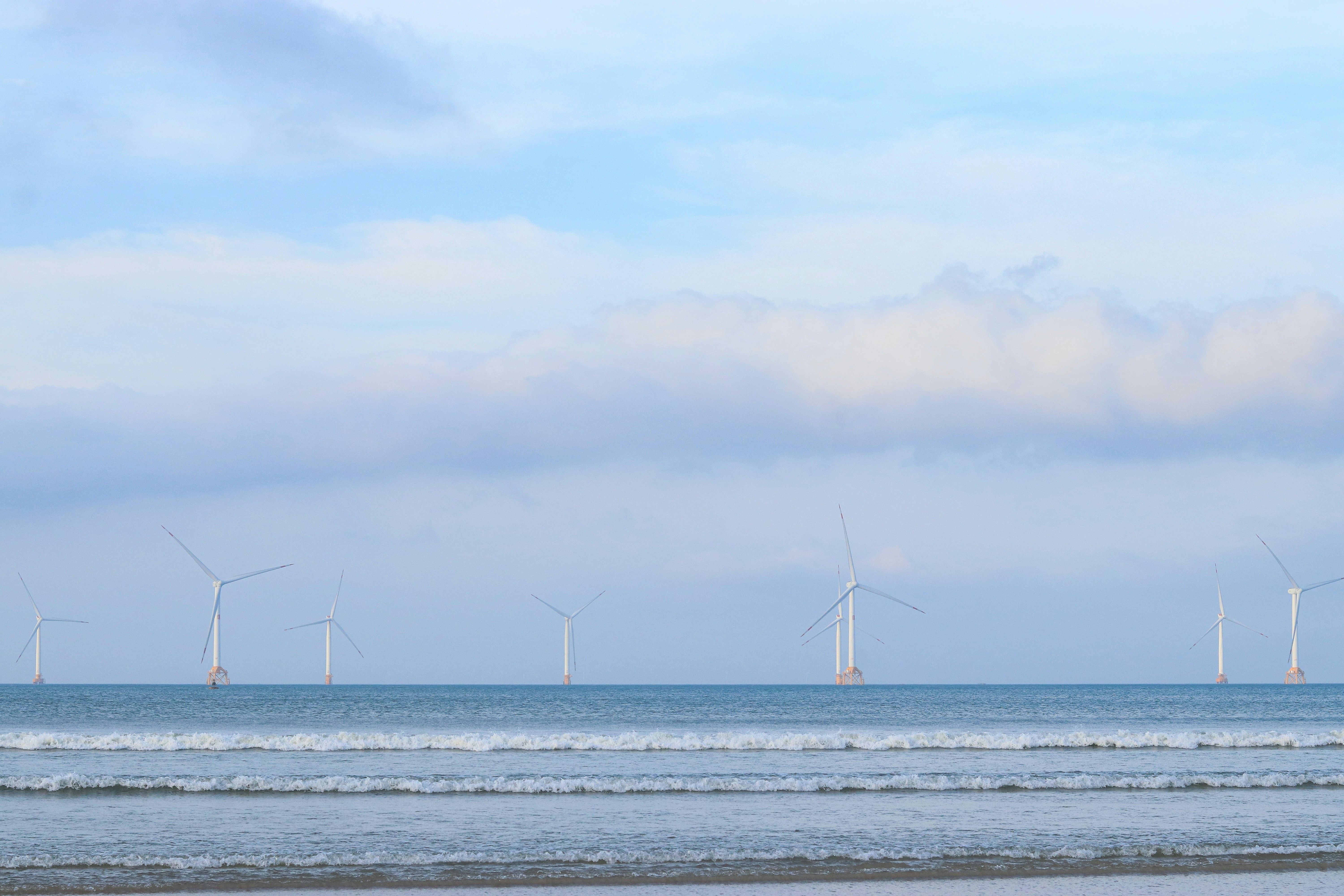 Offshore Windrow: A Quiet Line of Turbines Cadence the Horizon