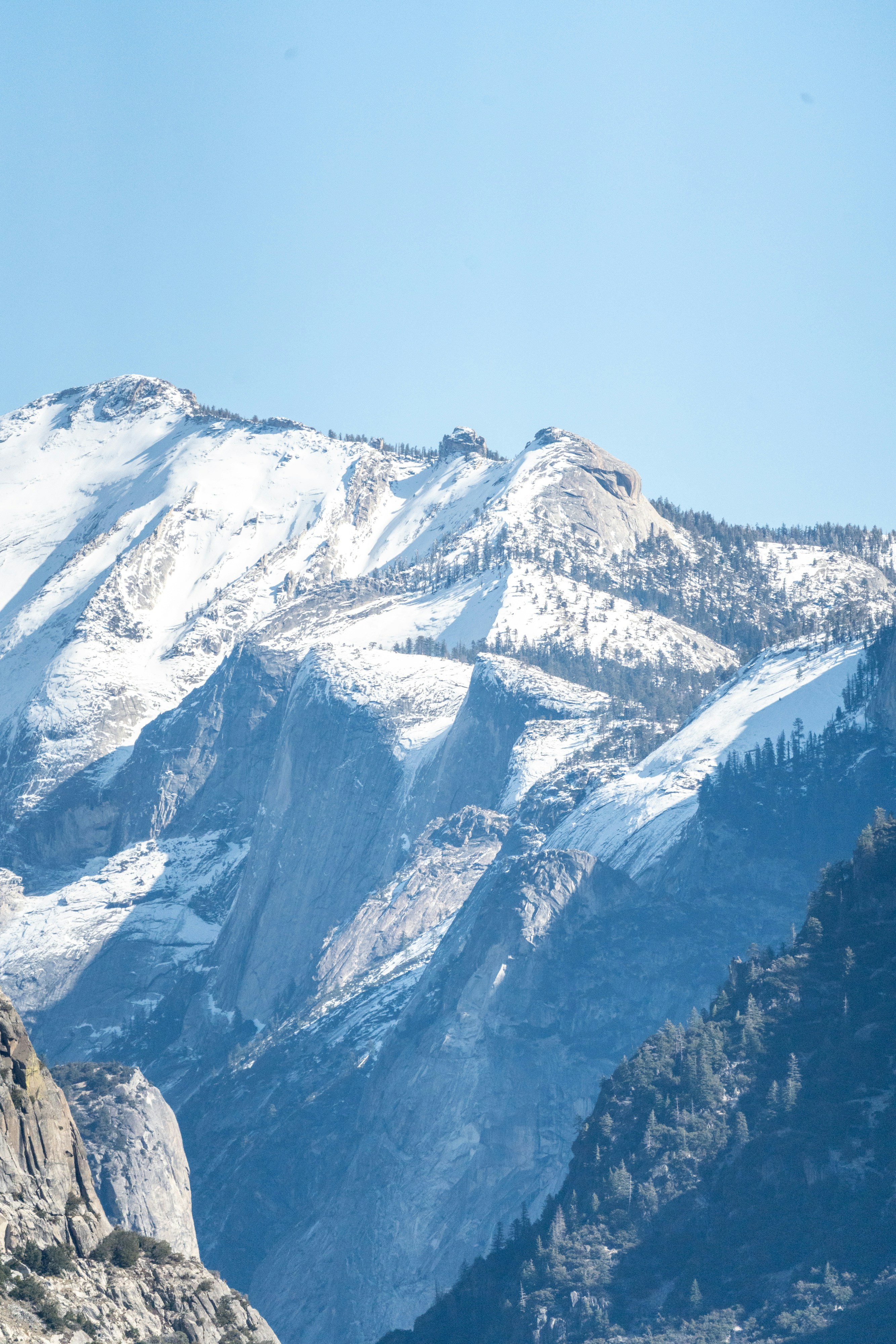 Snow-Capped Ridge under a Clear Alpine Sky