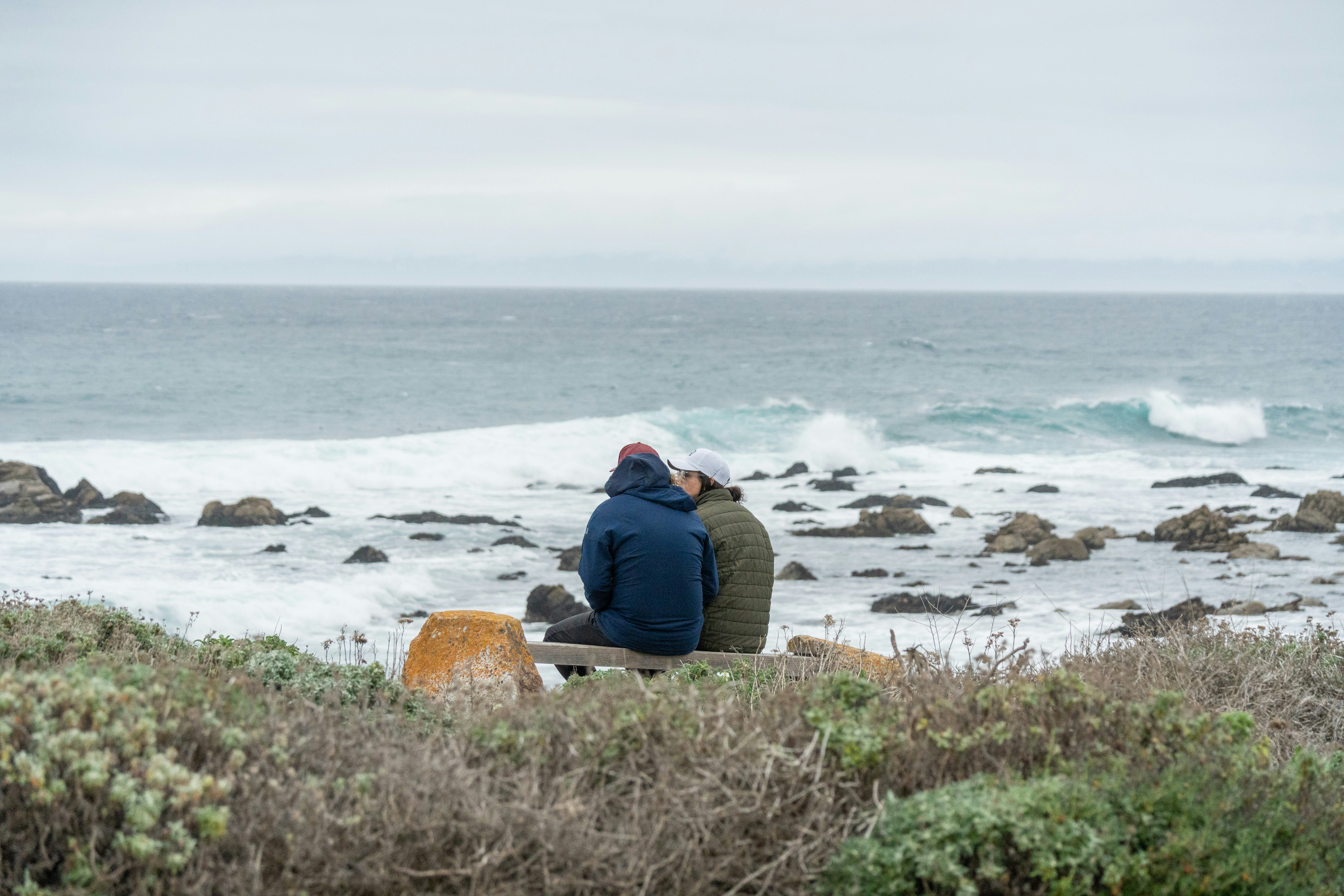 Two Figures on a Wind-Swept Clifftop Watching the Sea