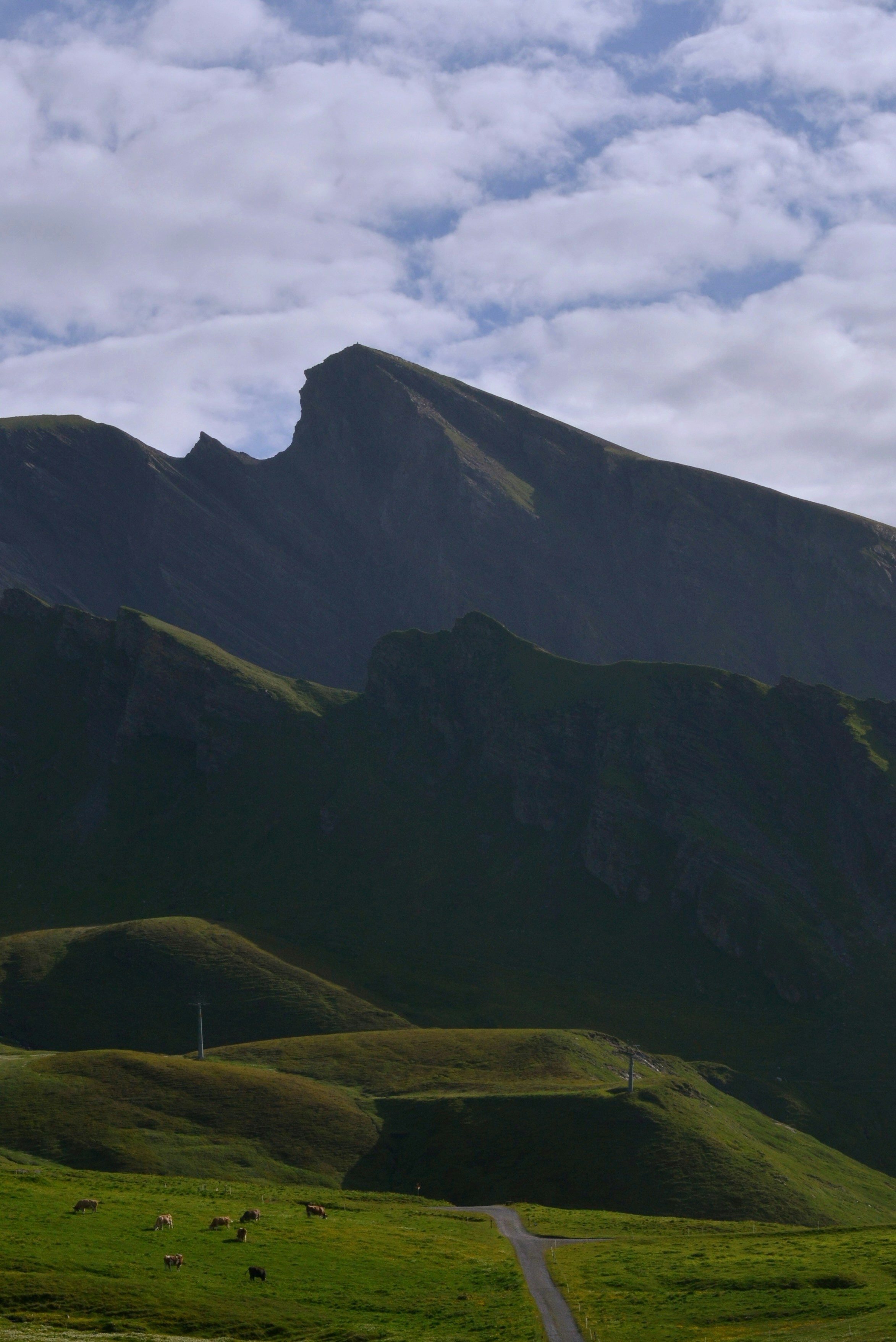 Green Hills and Ridge Under a Luminous Sky