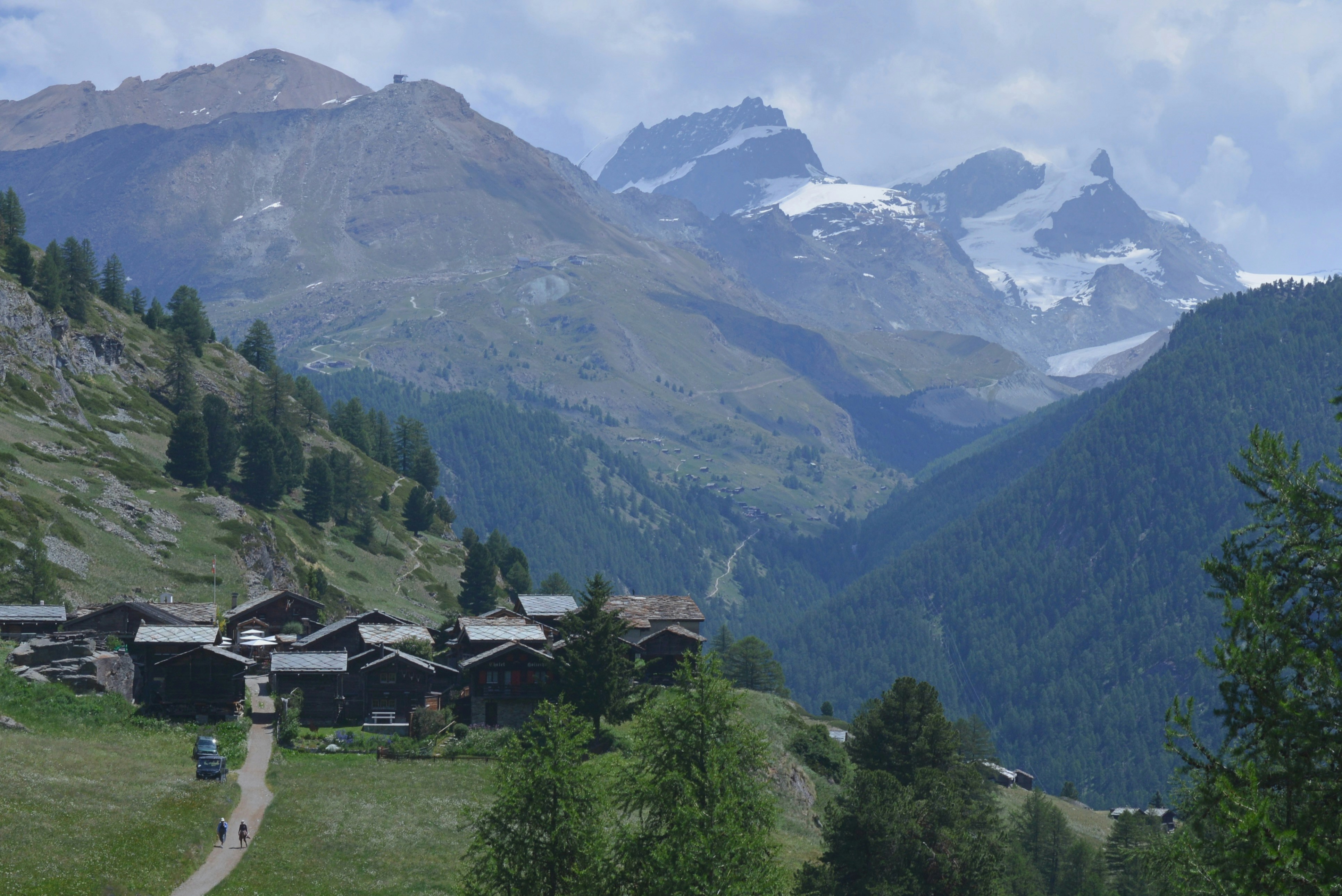 Alpine Village Terrace Beneath Snow-Kissed Peaks