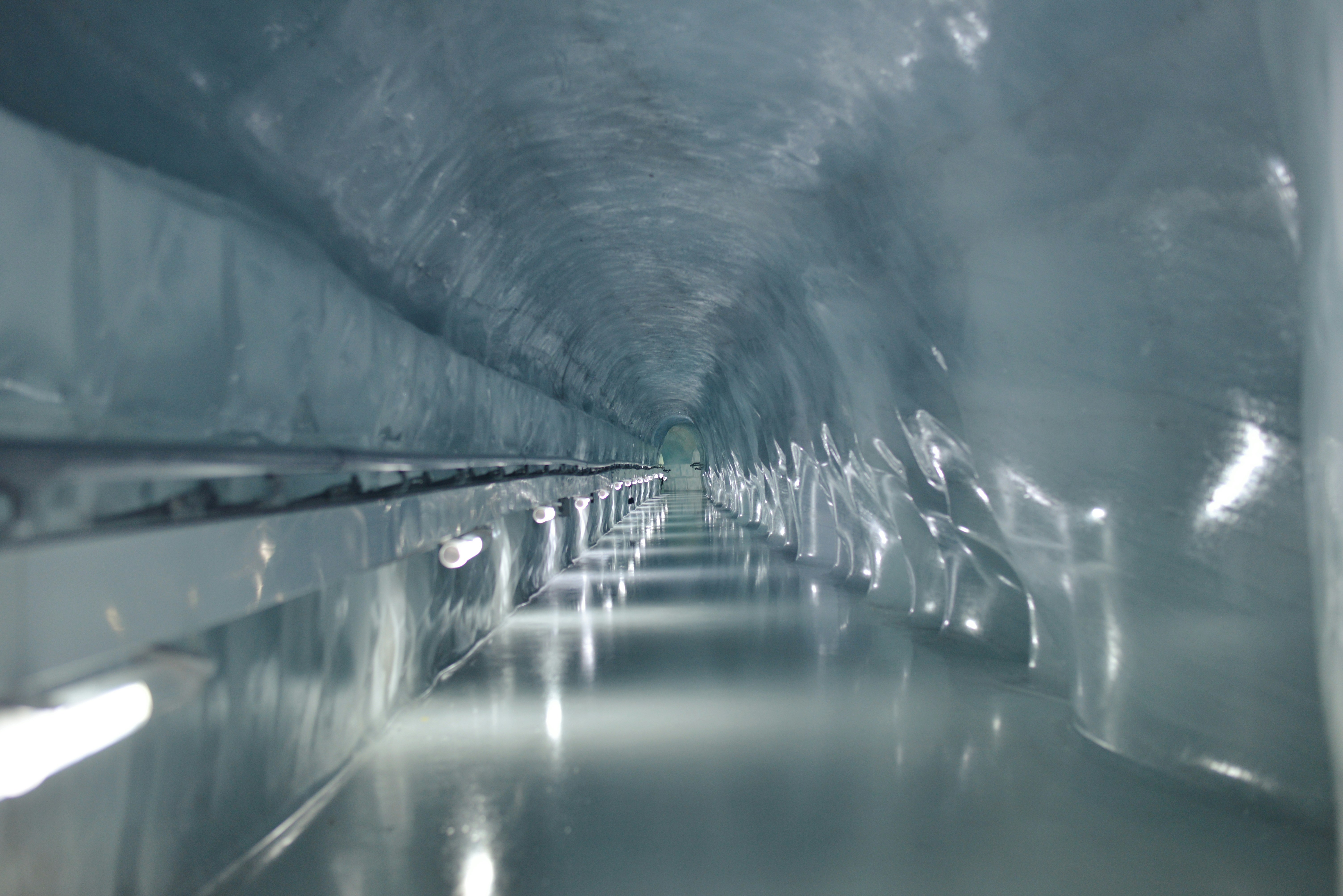 Ice‑tunnel Corridor: Glacial Reflections in a Narrow Window