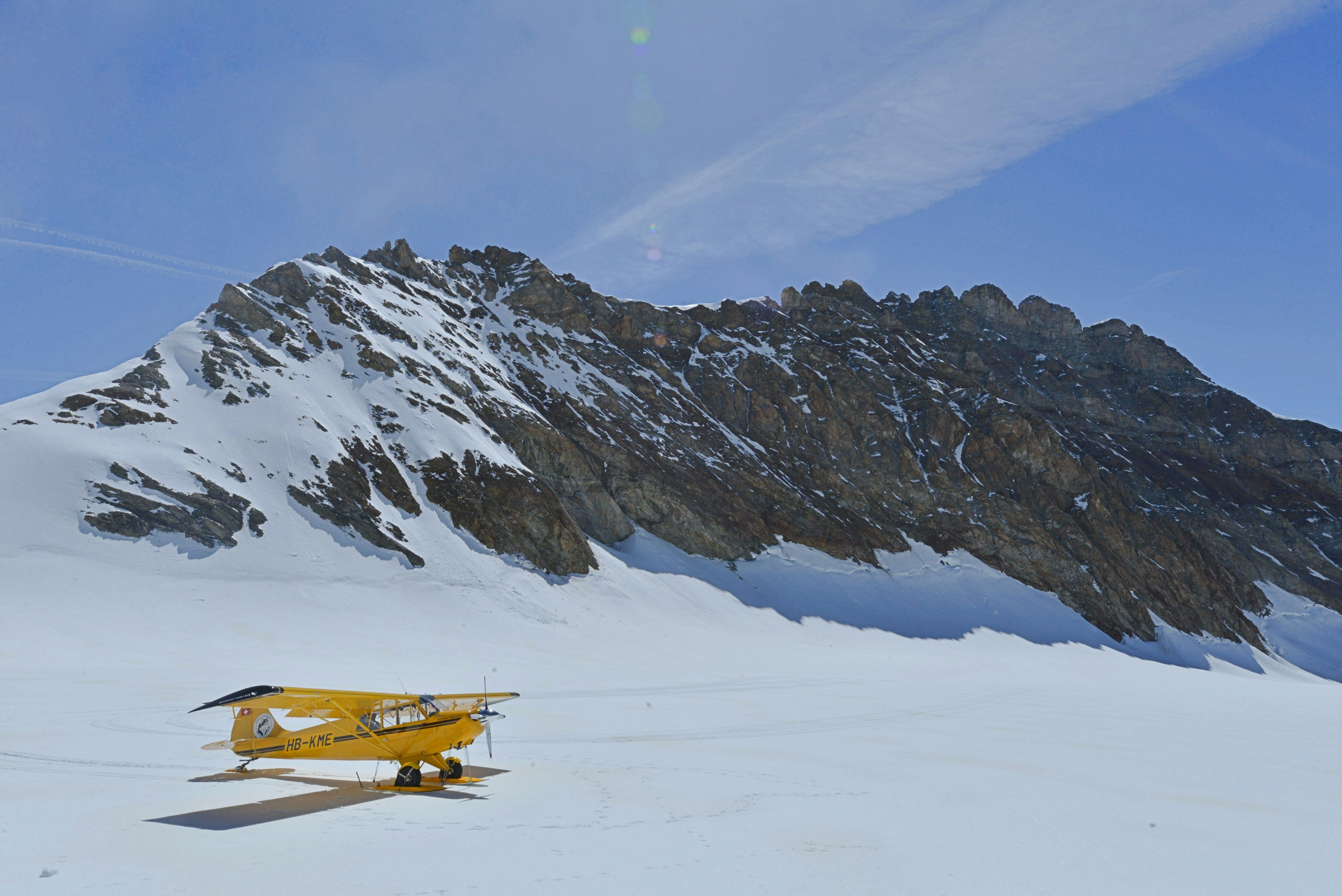 Yellow Snowbound Biplane at the Edge of the Snowfield