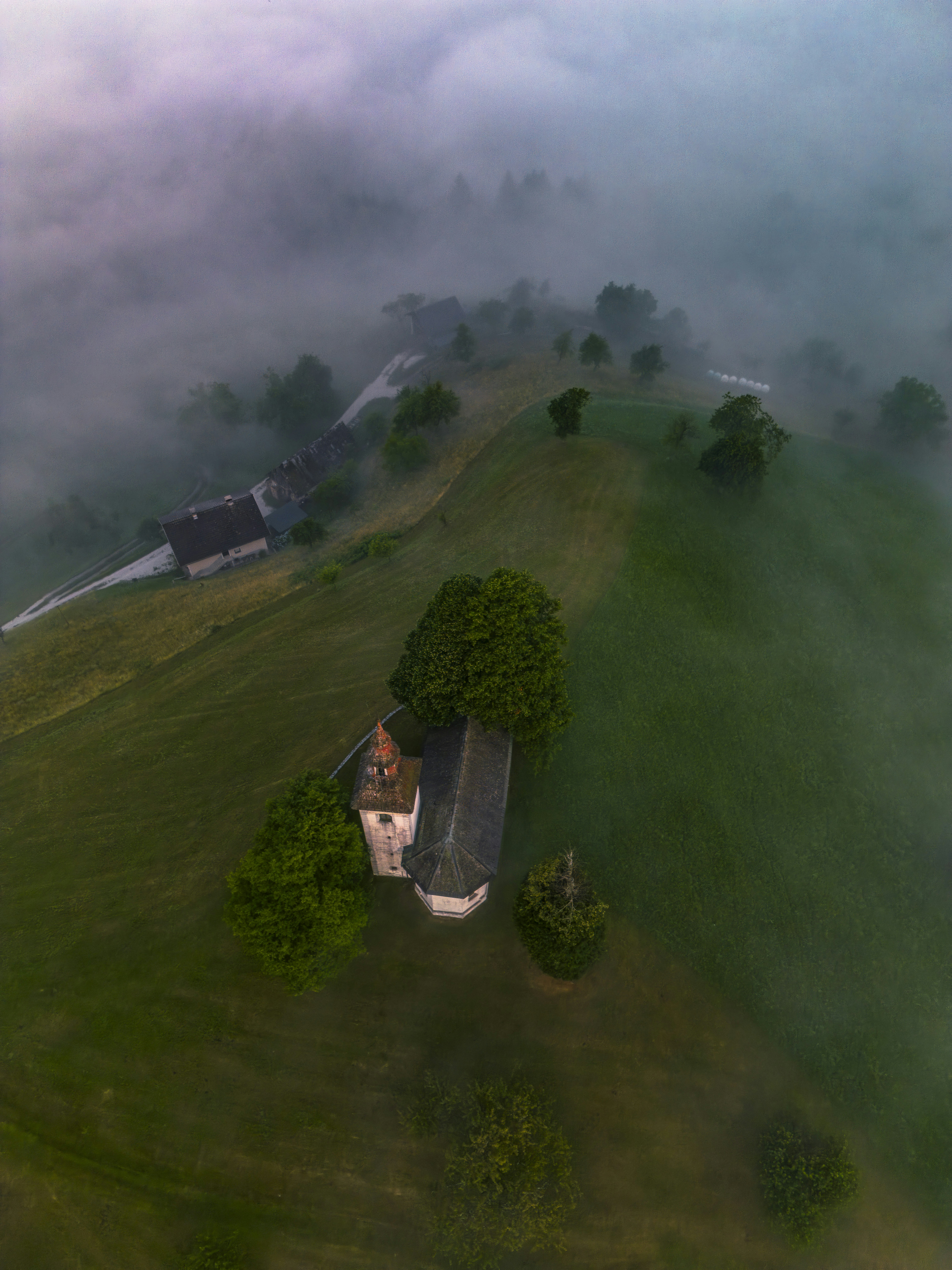 Hilltop Chapel Veiled in Mist