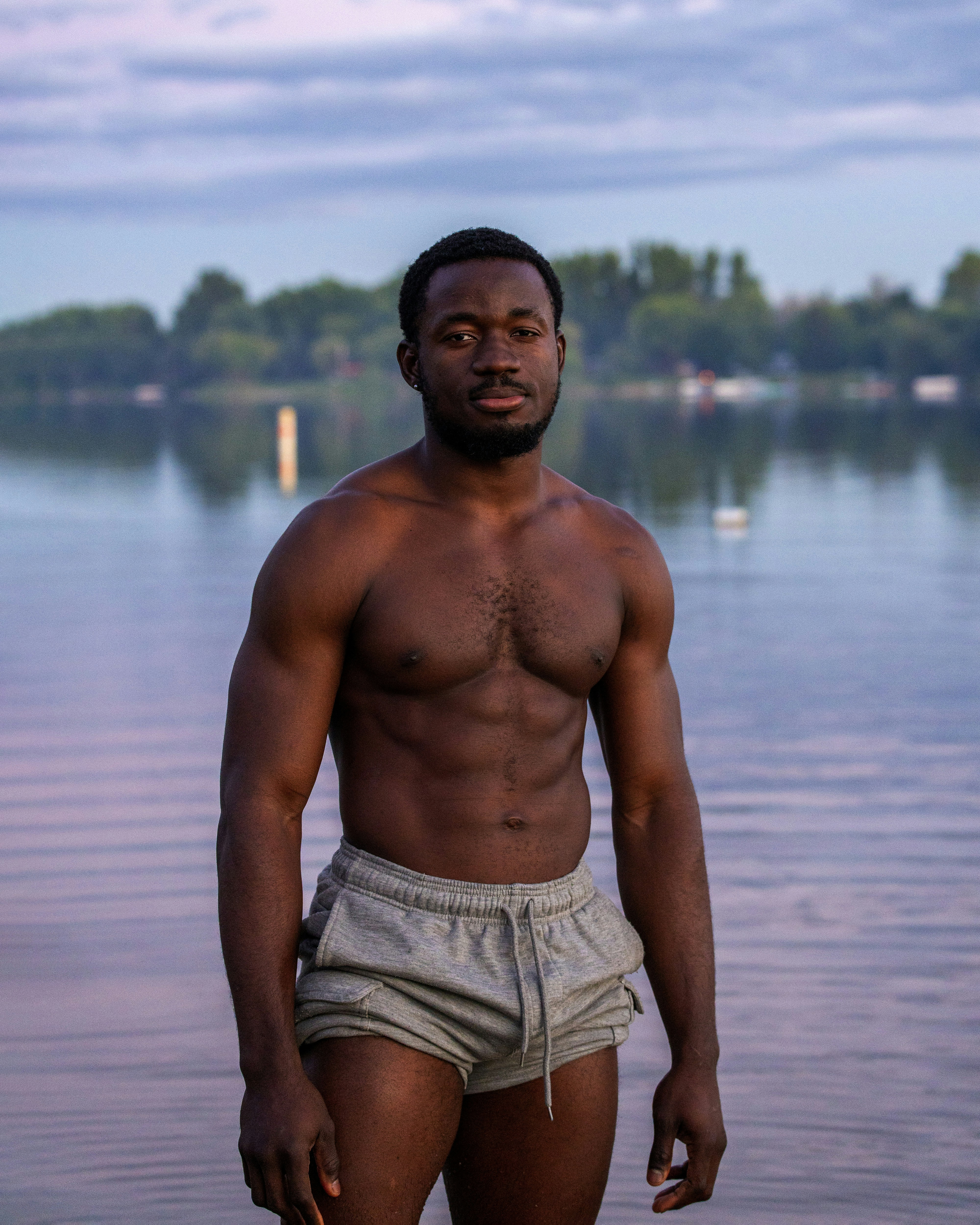 Athletic Calm by the Lake: A Portrait of Strength at Dusk