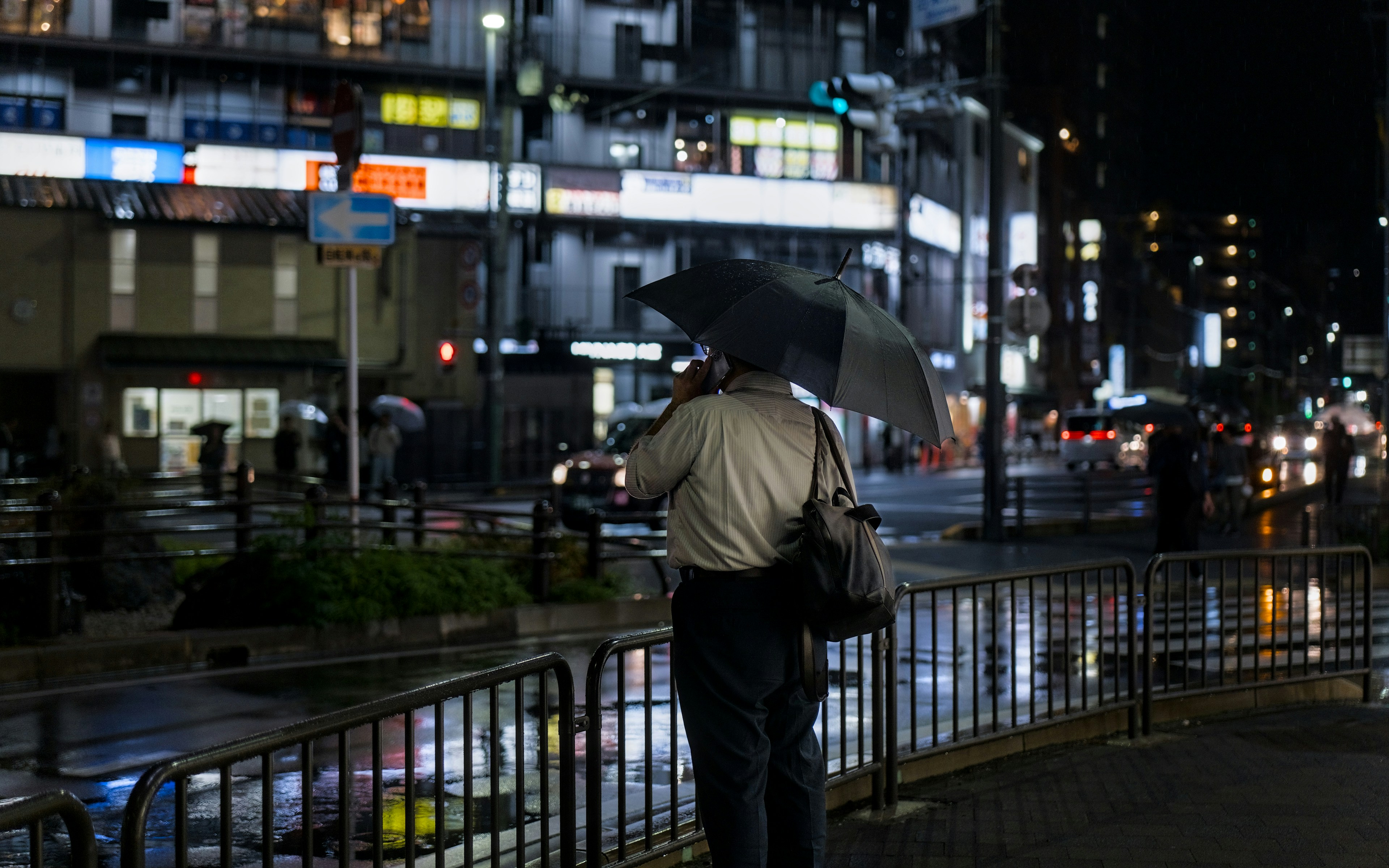 Night Rain, Quiet Steps: The Umbrella Keeper on a Neon Street