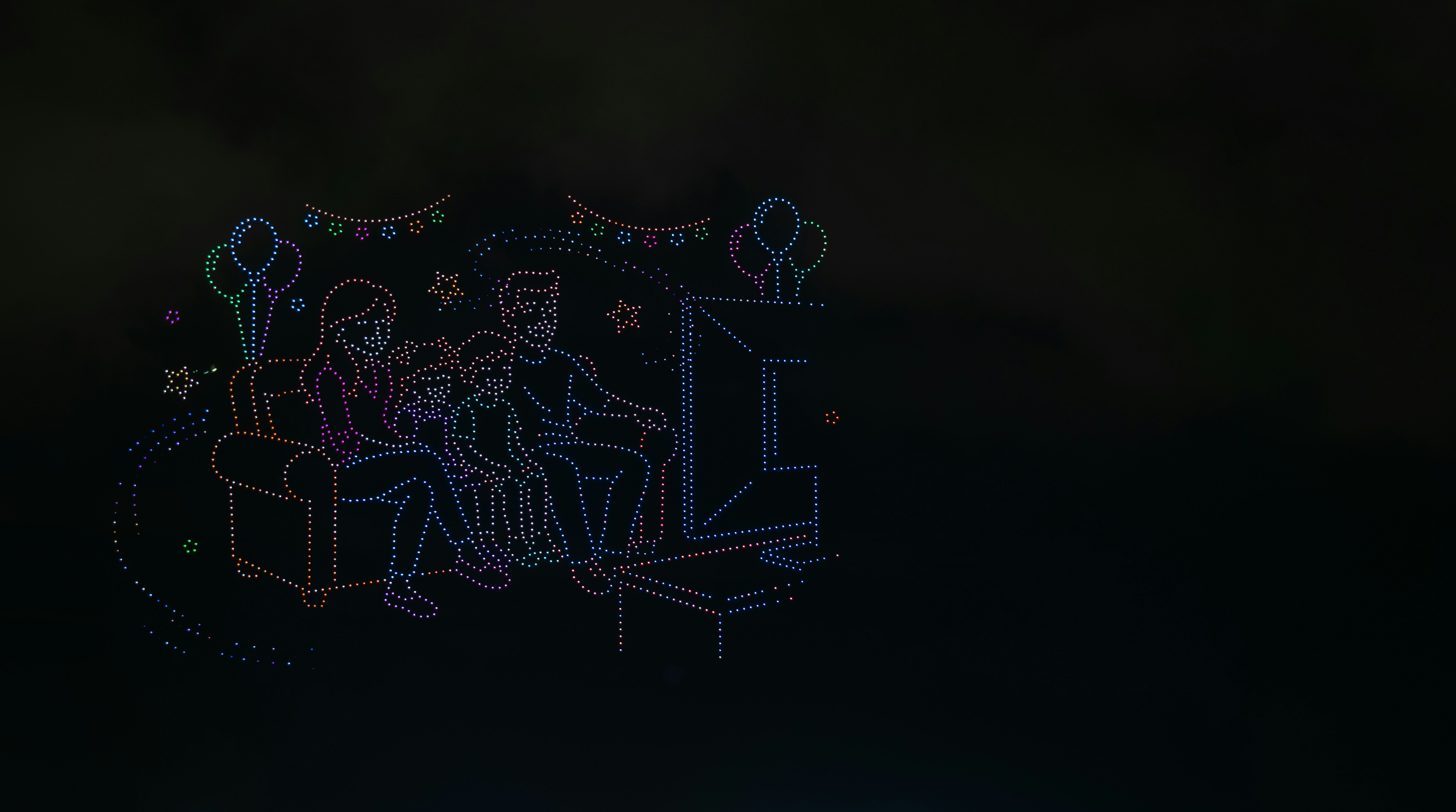 Night Parade of Neon Figures: A Holiday Silhouette in Lights
