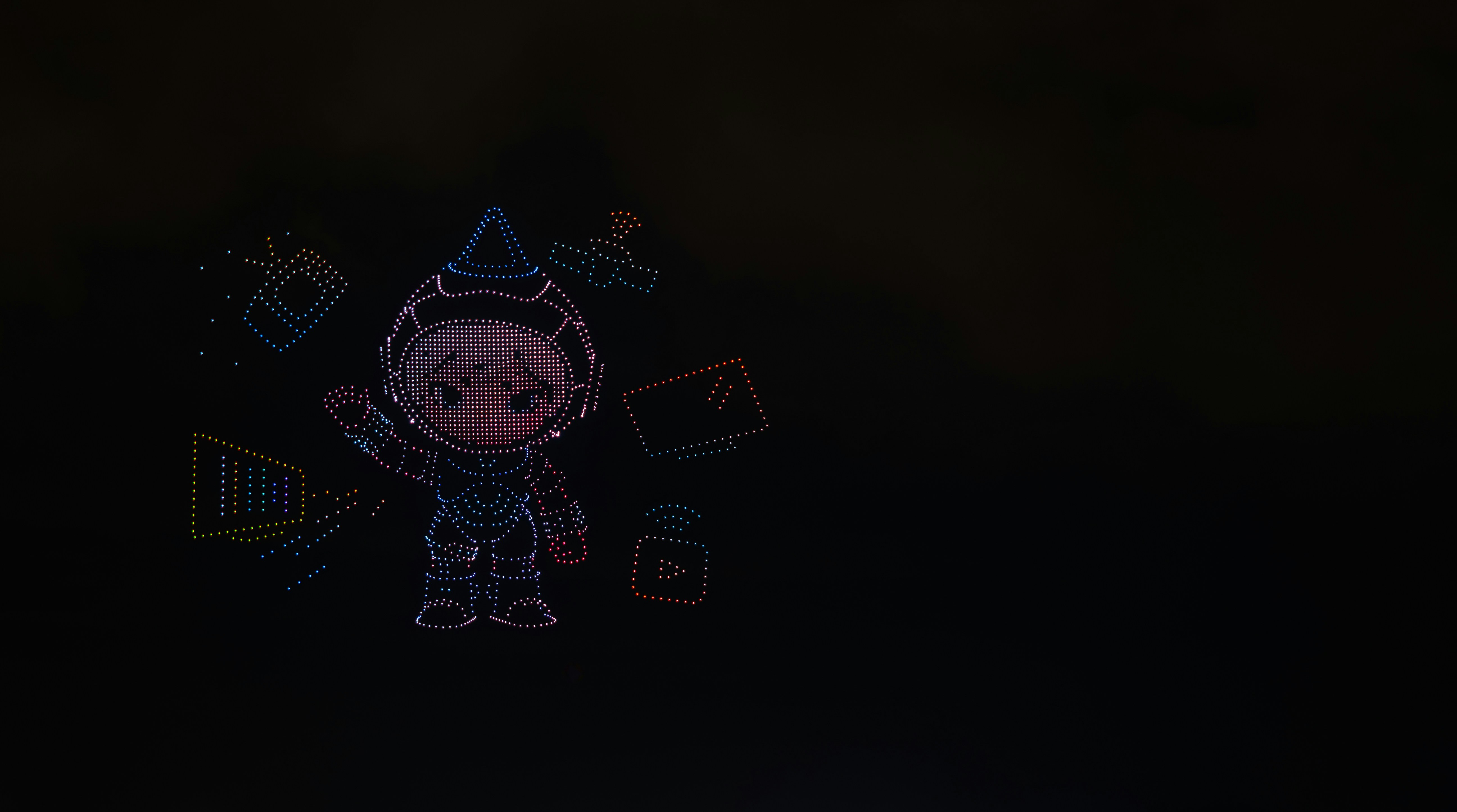 Lantern-lit Neon Character Above a Dark Horizon